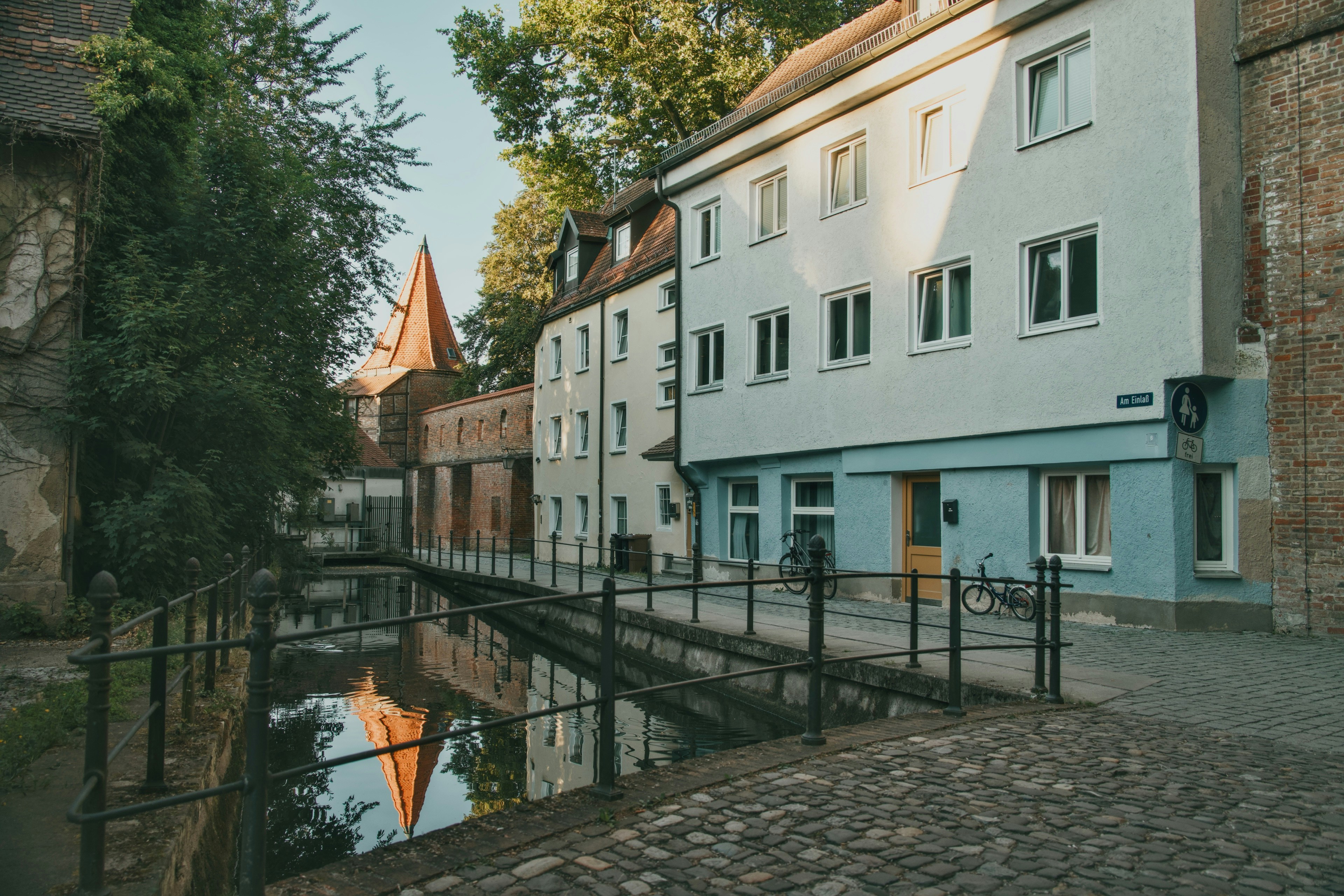 Reflection of a Turreted Town in a Quiet Canal