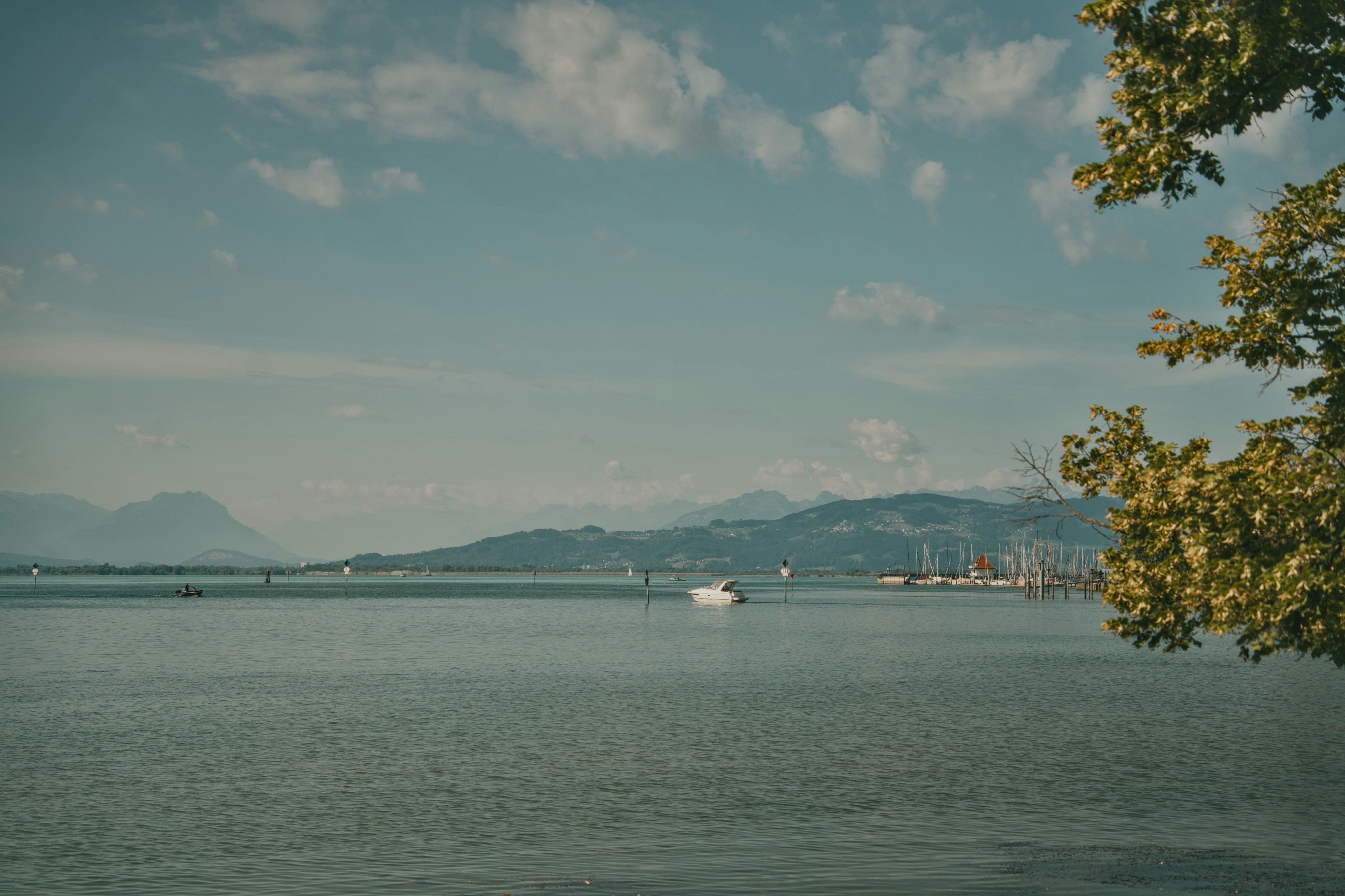 Calm Lake Vista at Distant Mountain Horizon