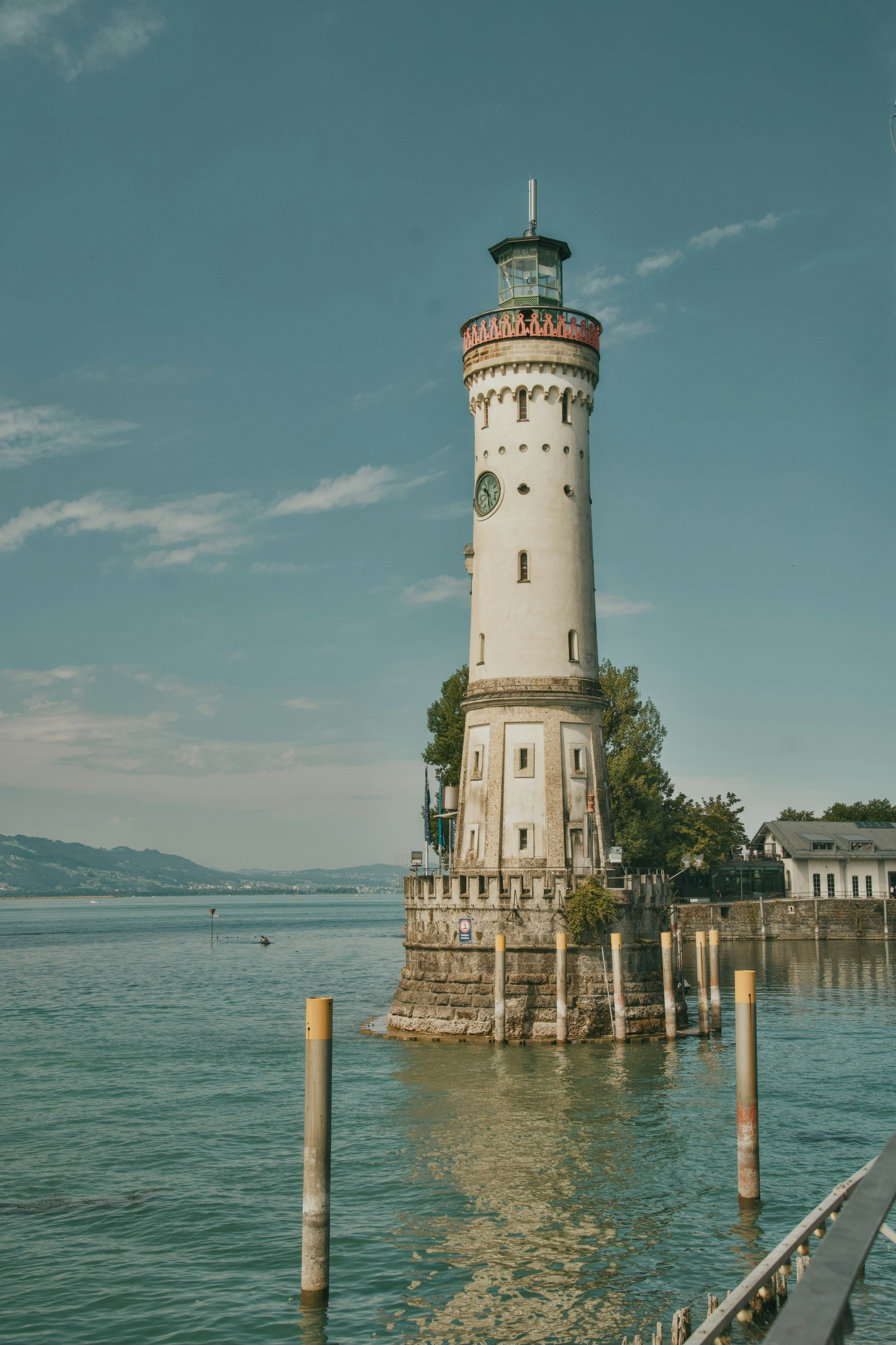 Beacon Over Calm Waters: The Towering Lighthouse at the Pier