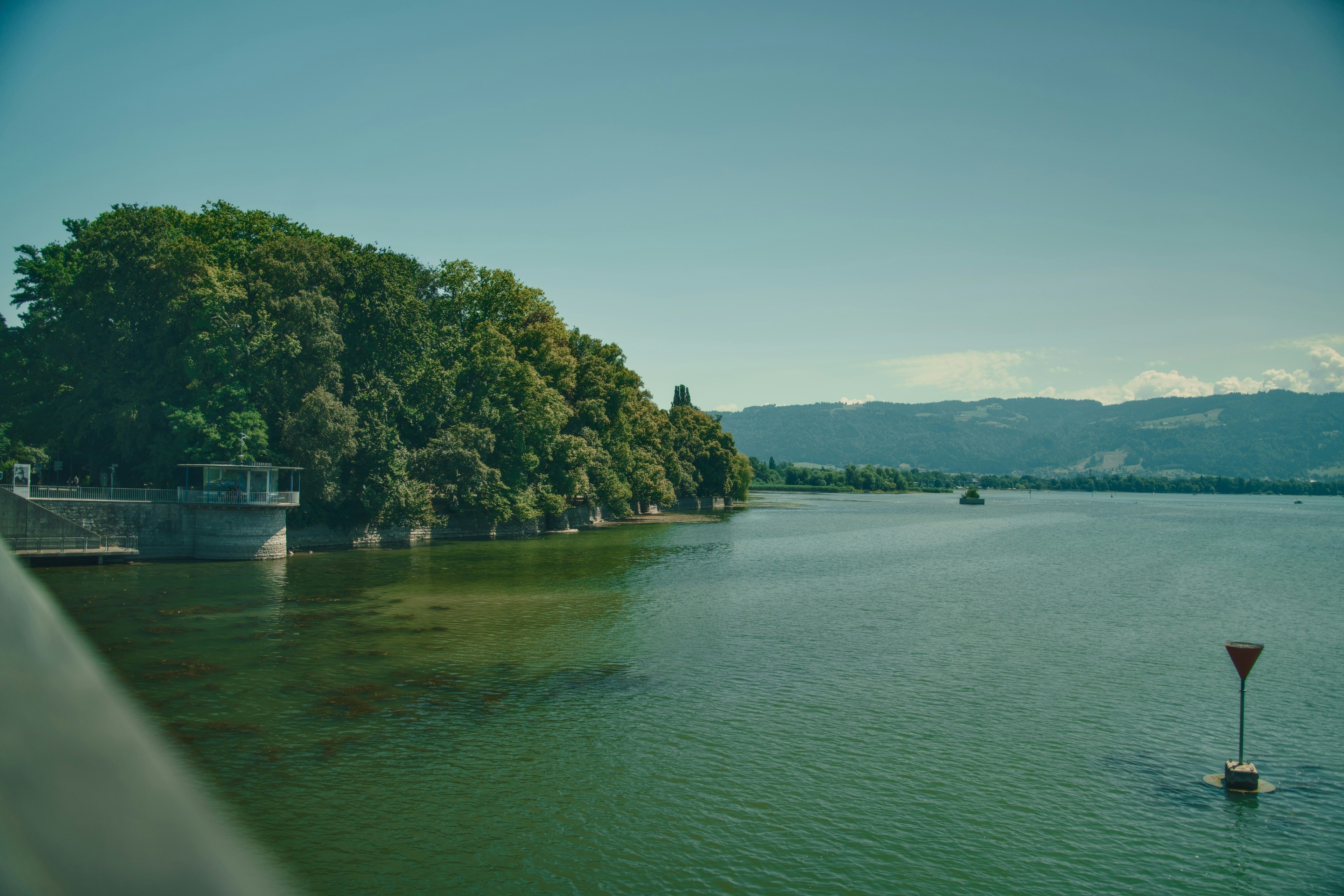Quiet Waters by the Riverbend with Distant Hills