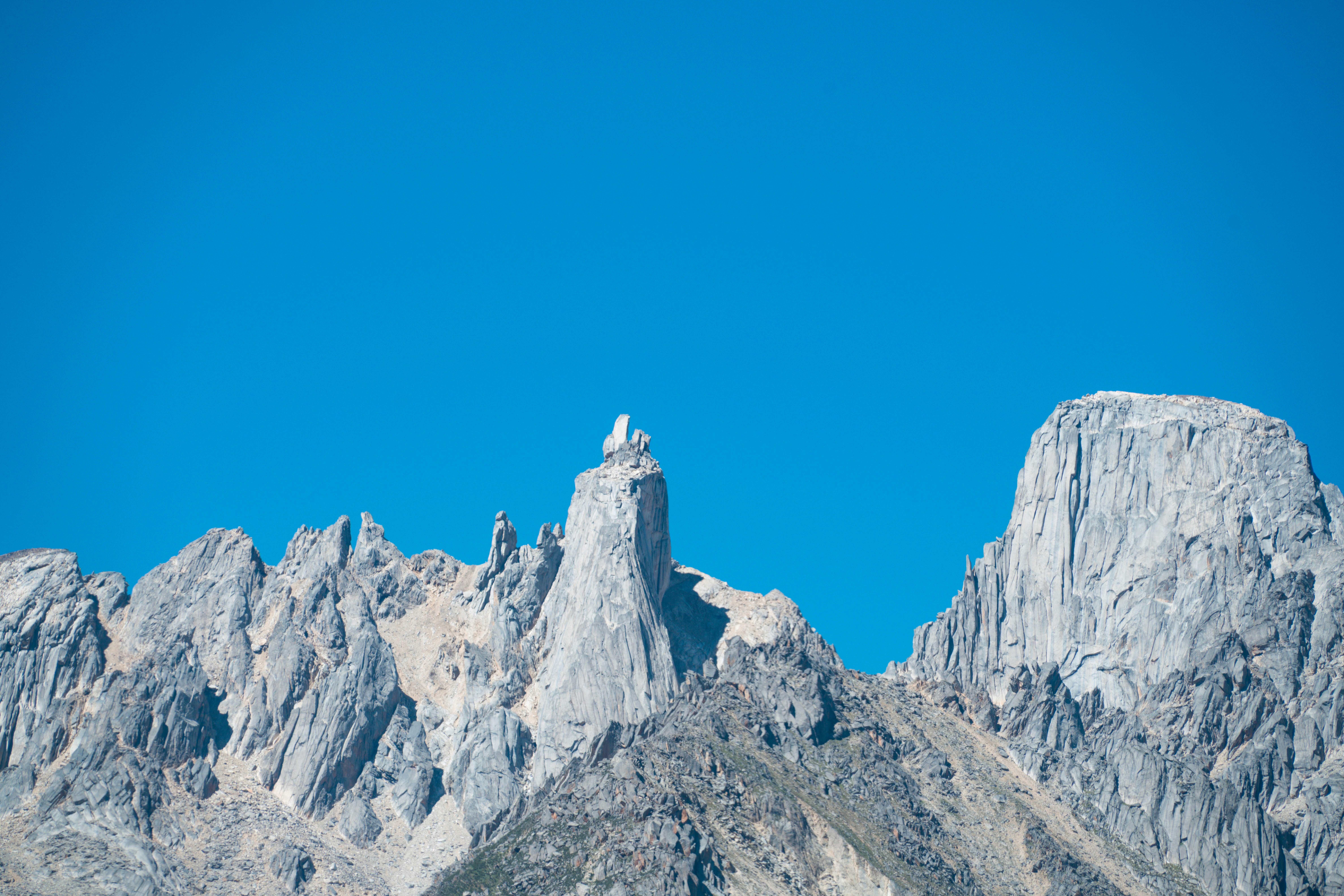 Ridgecrest Sentinel: A Lone Peak Sculpted Against a Vivid Blue Sky