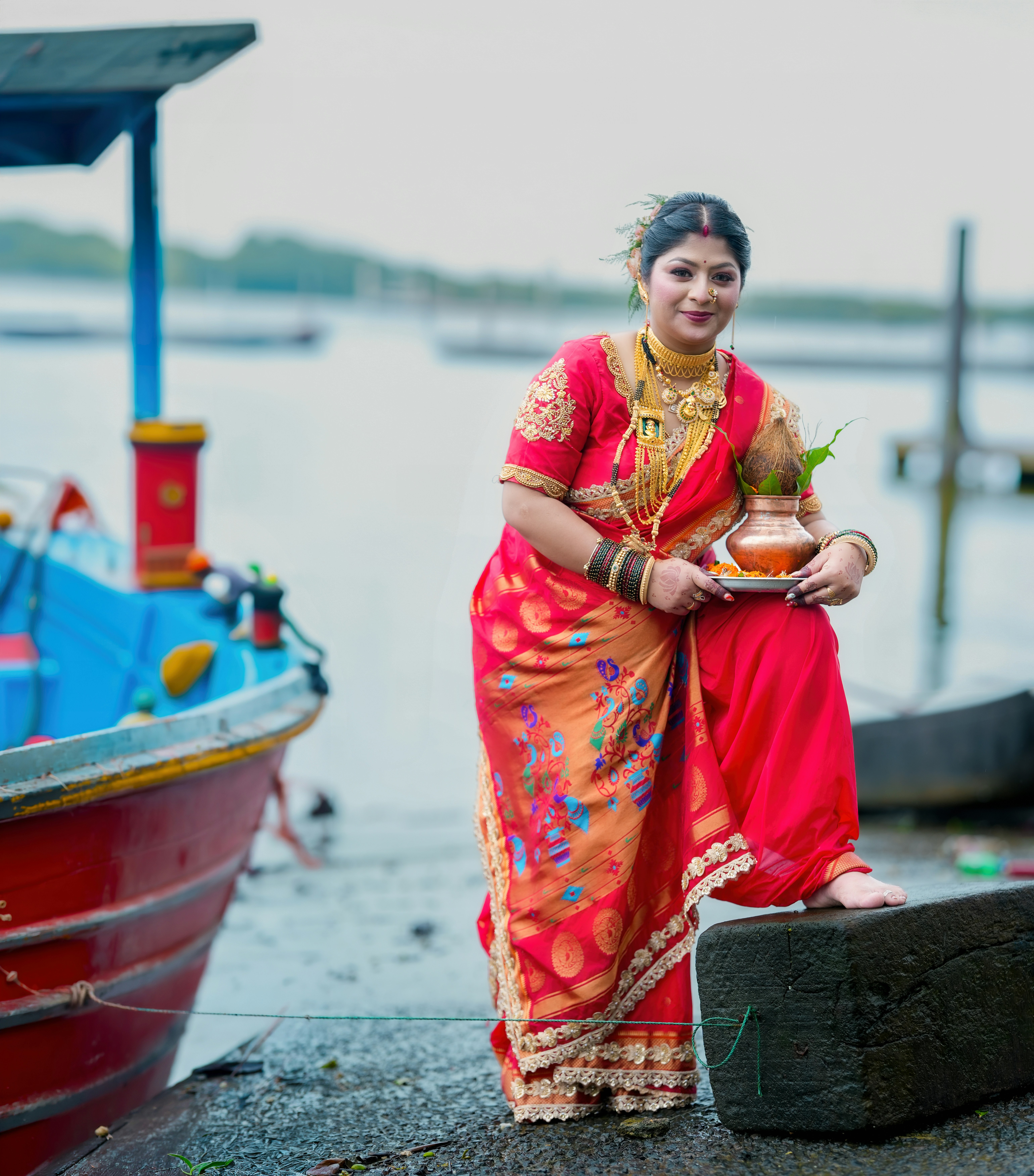 Vibrant Saree on the Waterfront: A Ritual by the Shore