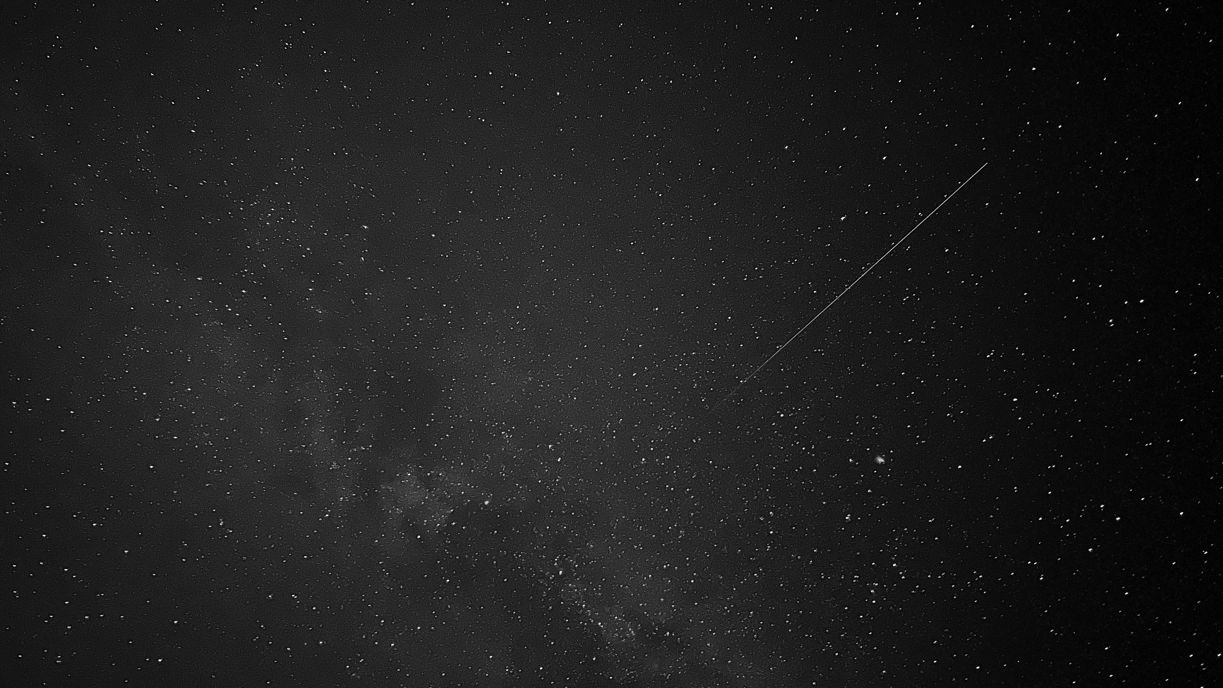 Meteor Arc Across a Quiet Milky Way Night