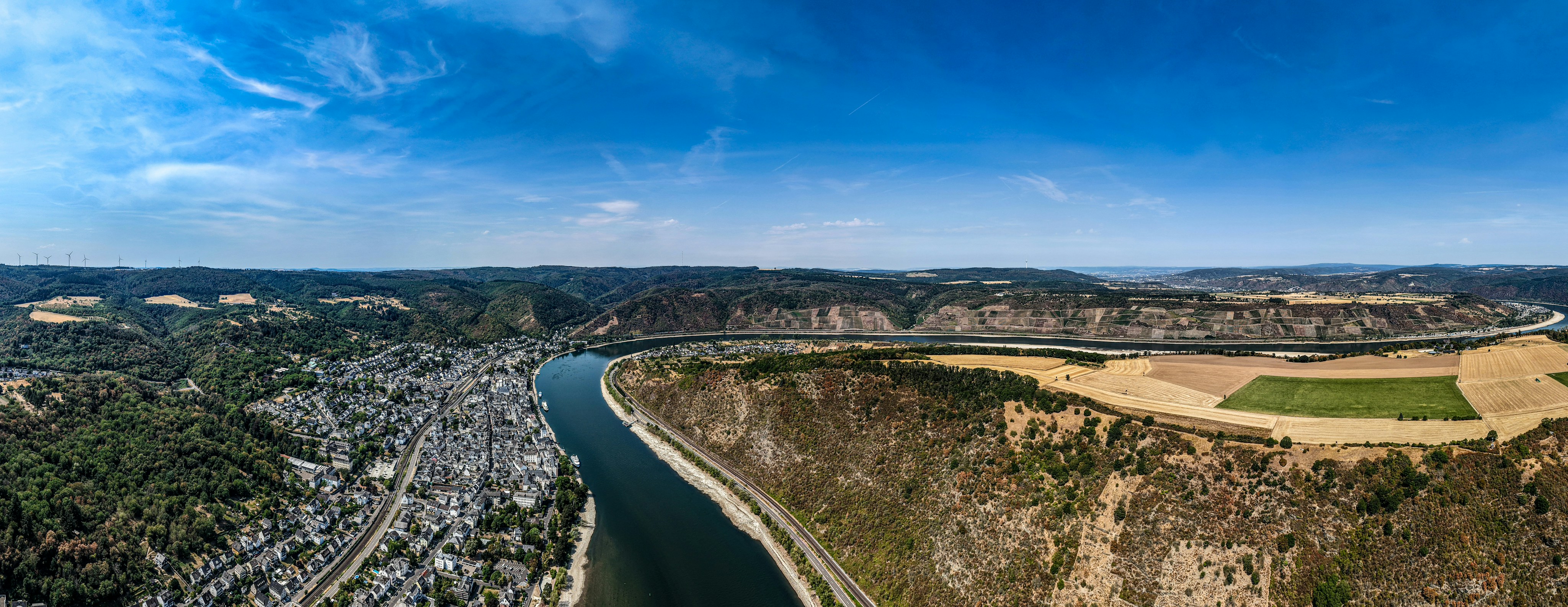 Meandering River Arc Over Limestone Cliffs
