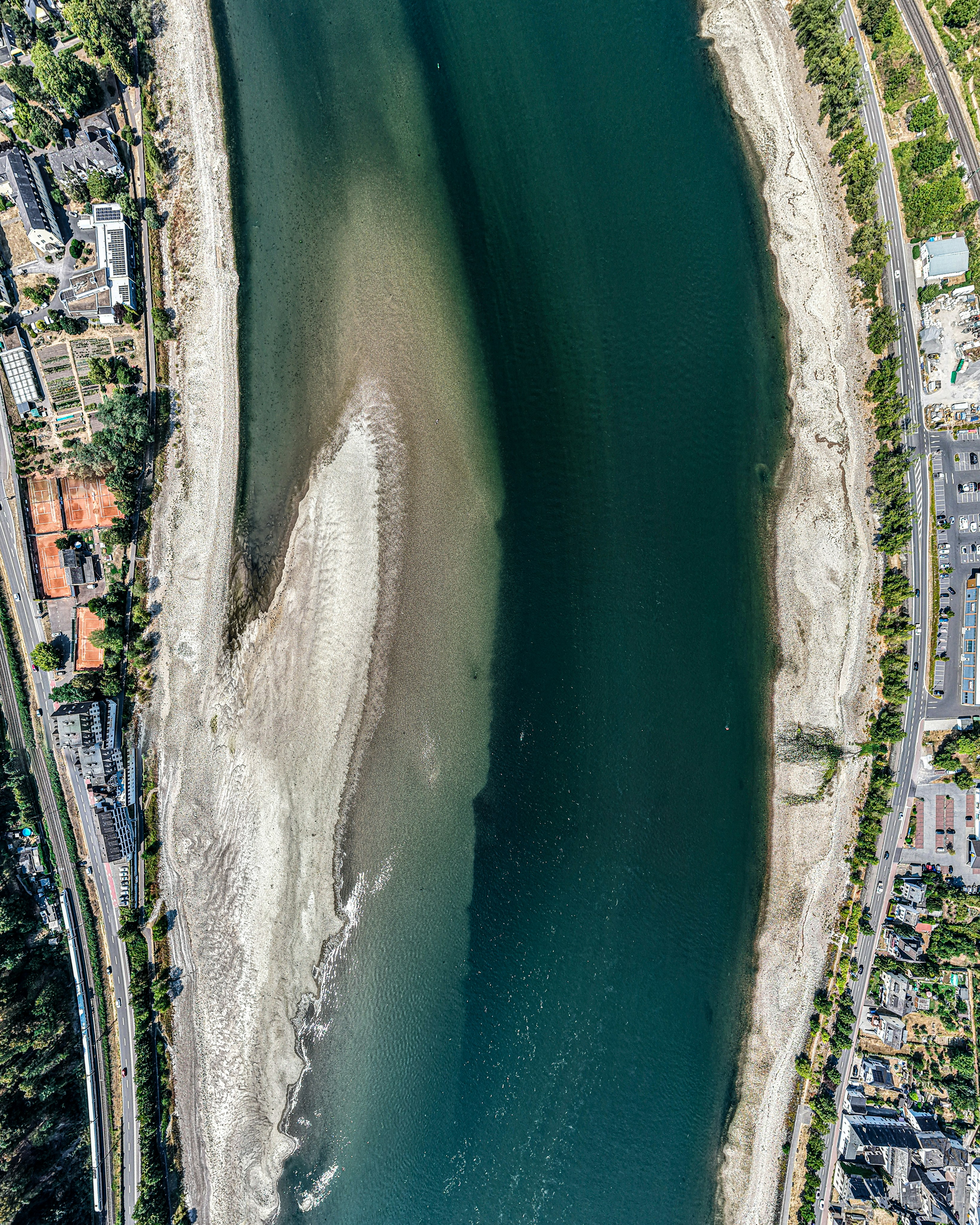 Riverbend Corridor: Aerial Confluence Along Urban Shore