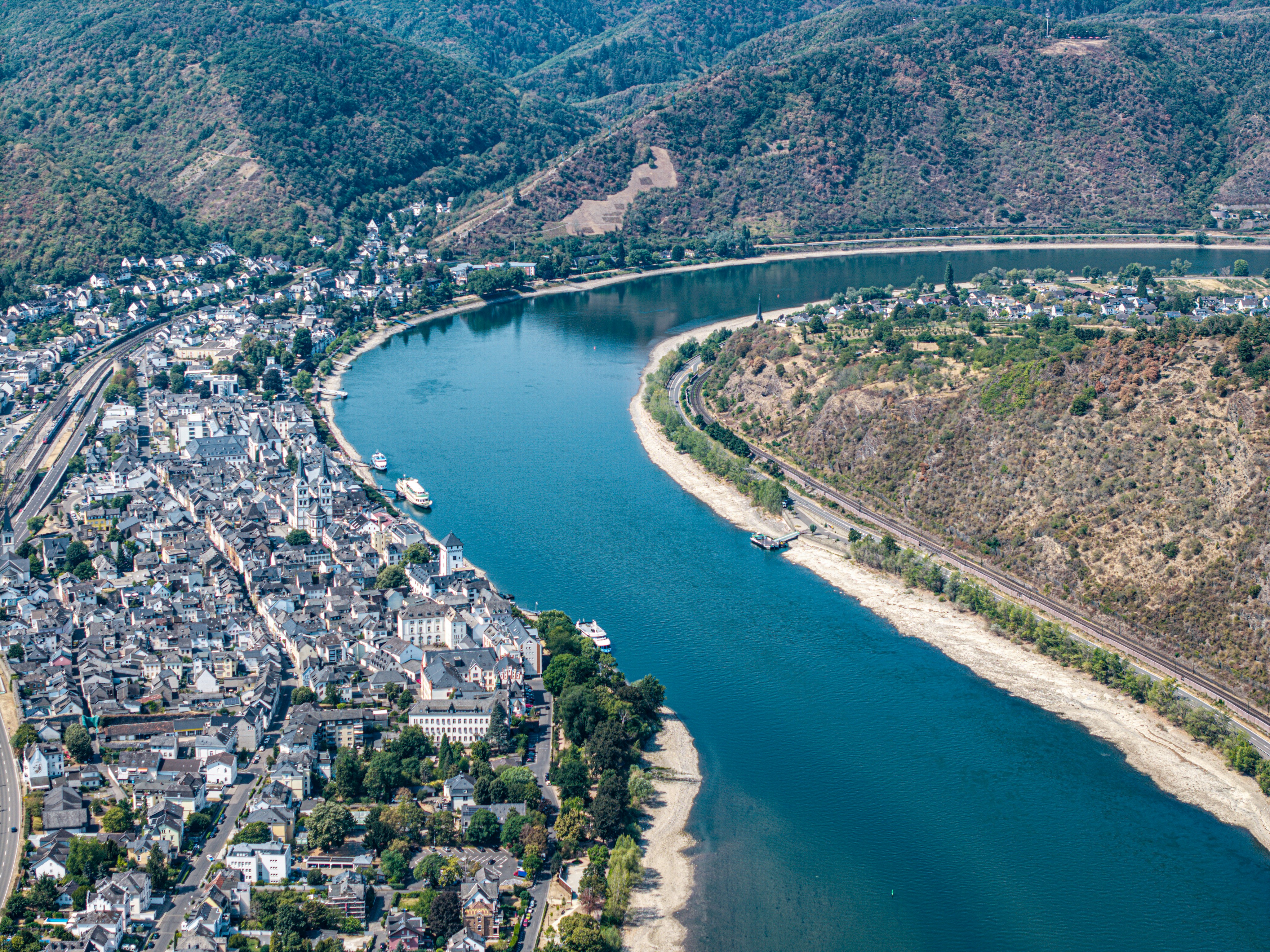 Riverbend Town slotted between hills: an aerial blueprint