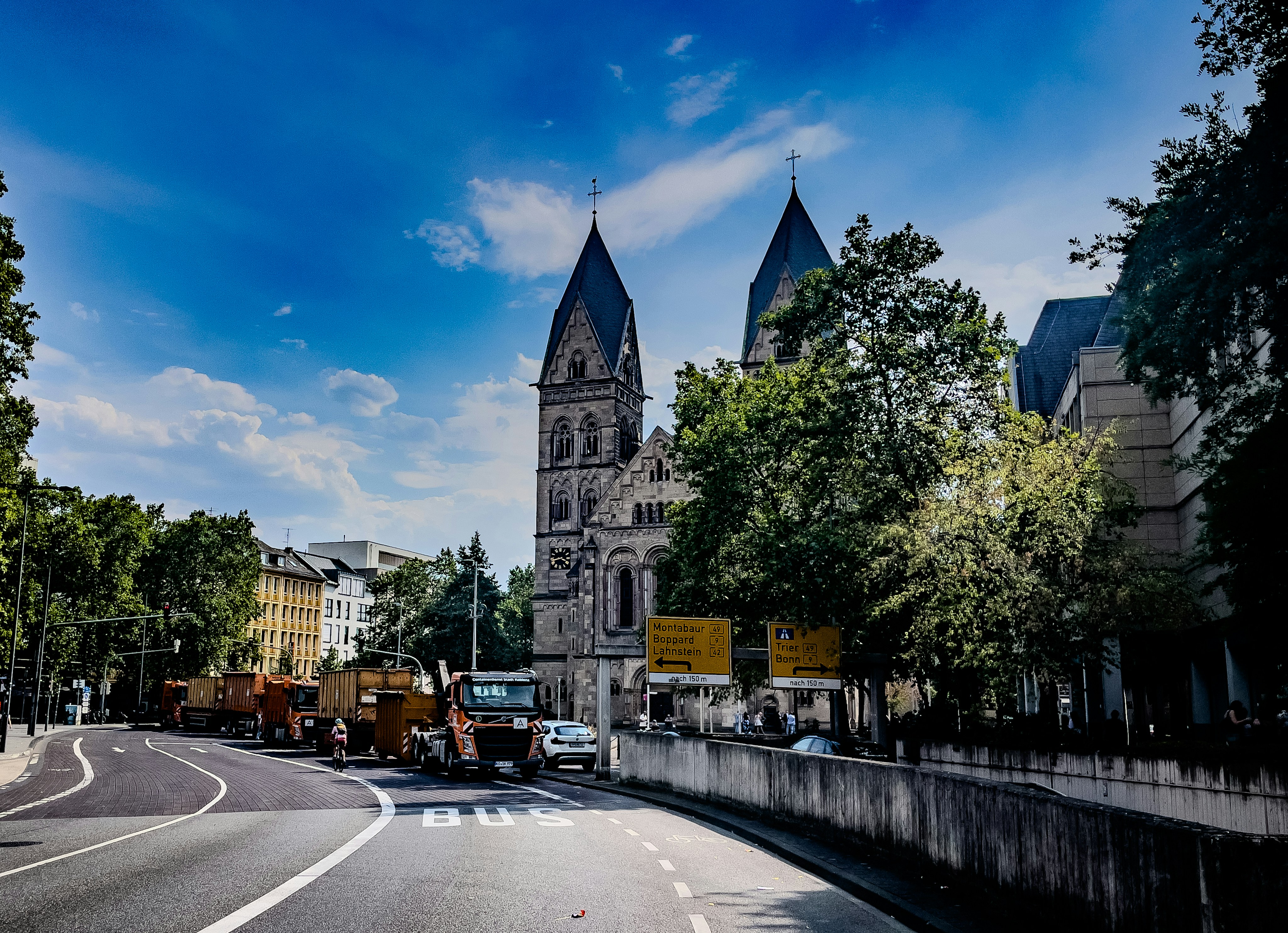 Cathedral Towers Over a Busy City Street