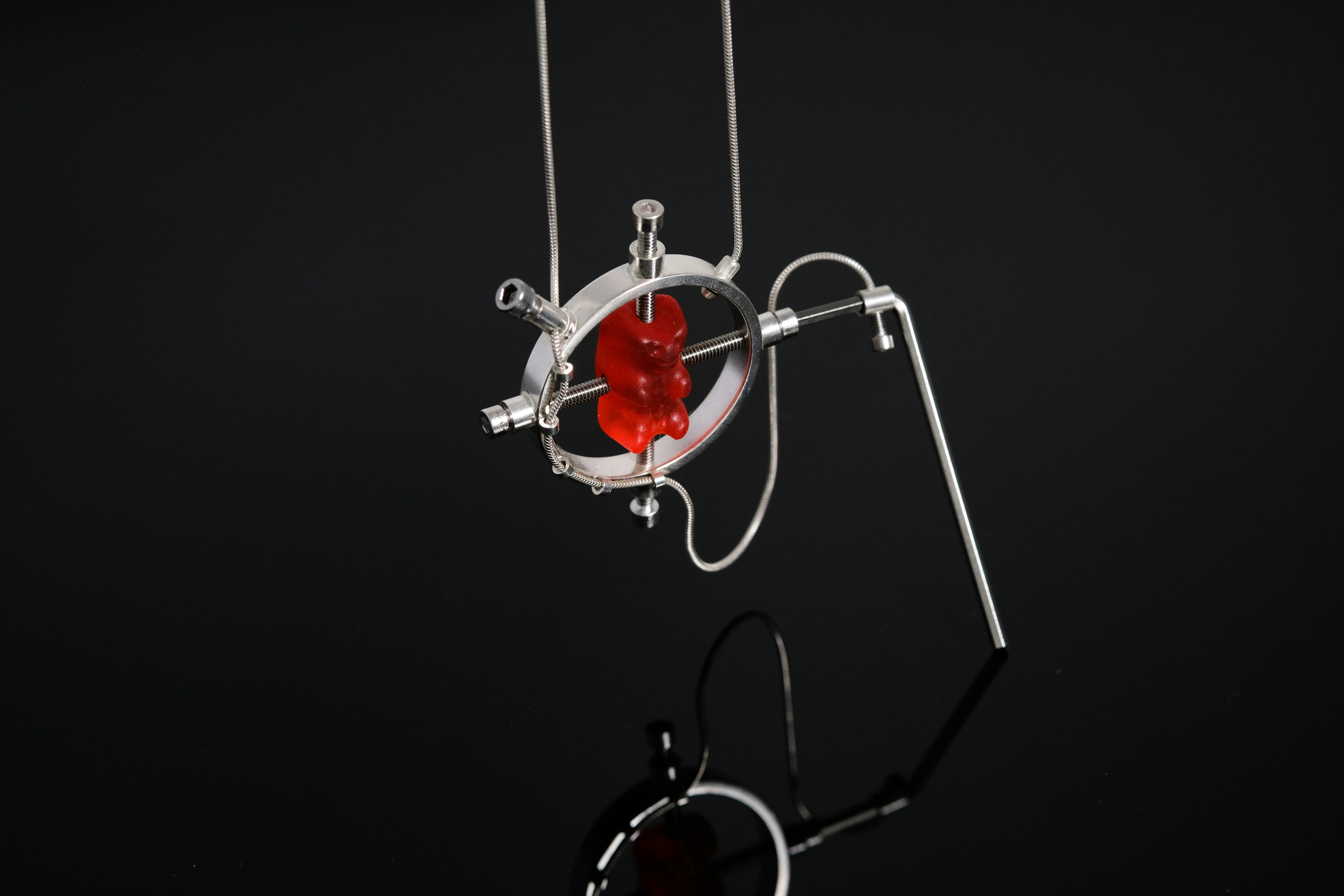 Red Heart in the Clamp: A Minimal Mechanical Portrait