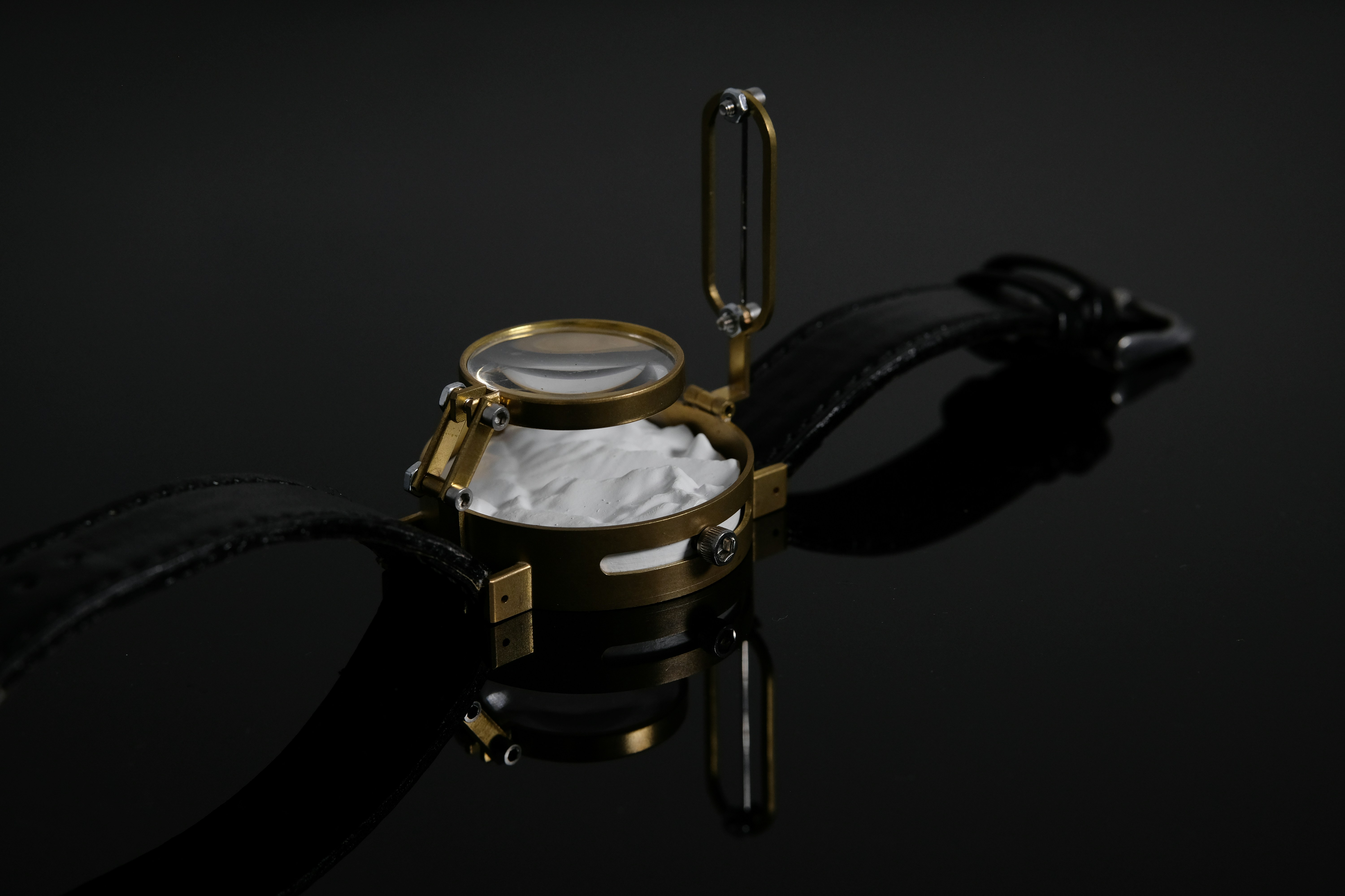 Clockwork in Black: A Magnified Gaze at a Brass Winder