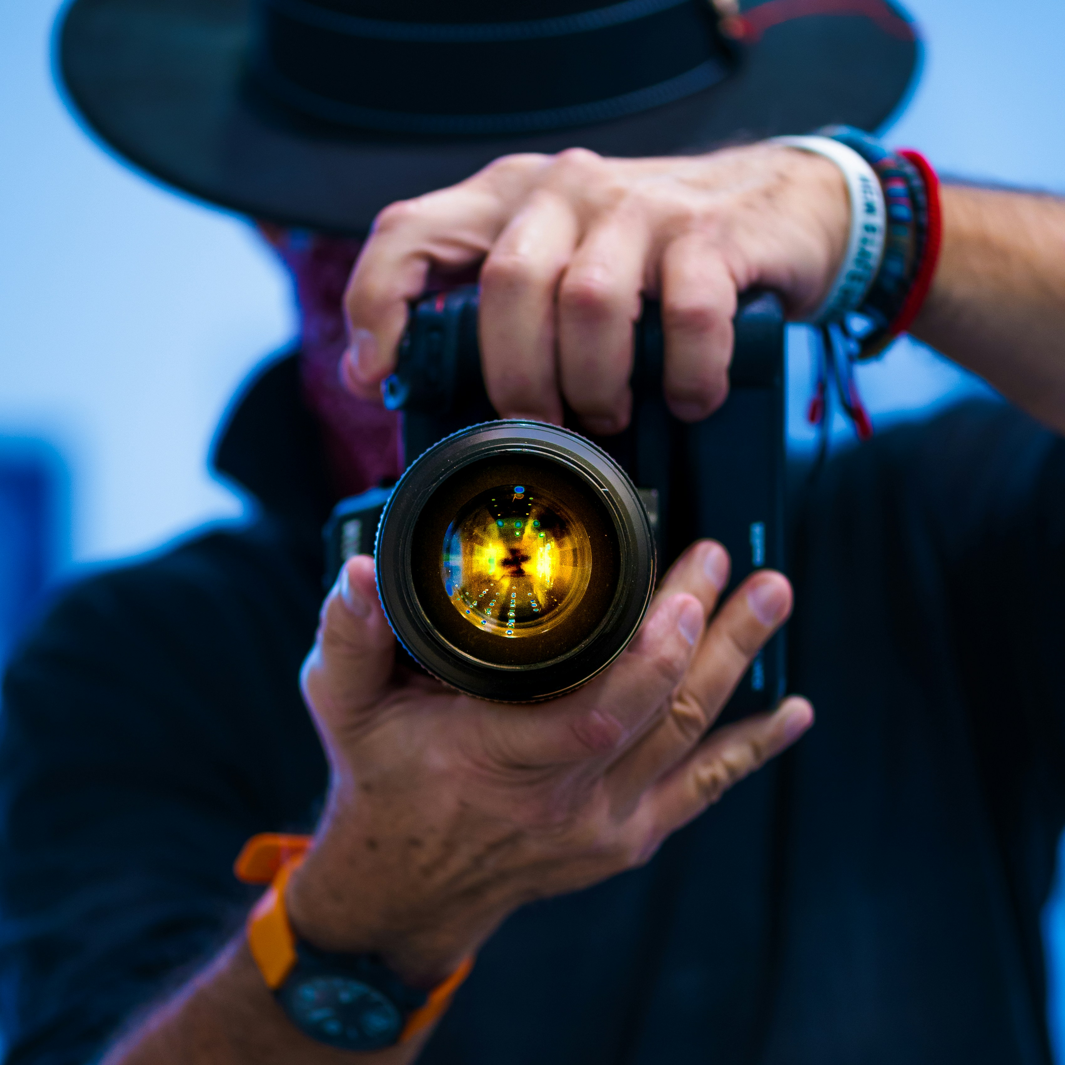Through the Lens: Focus on the Hand and Reflective Glass