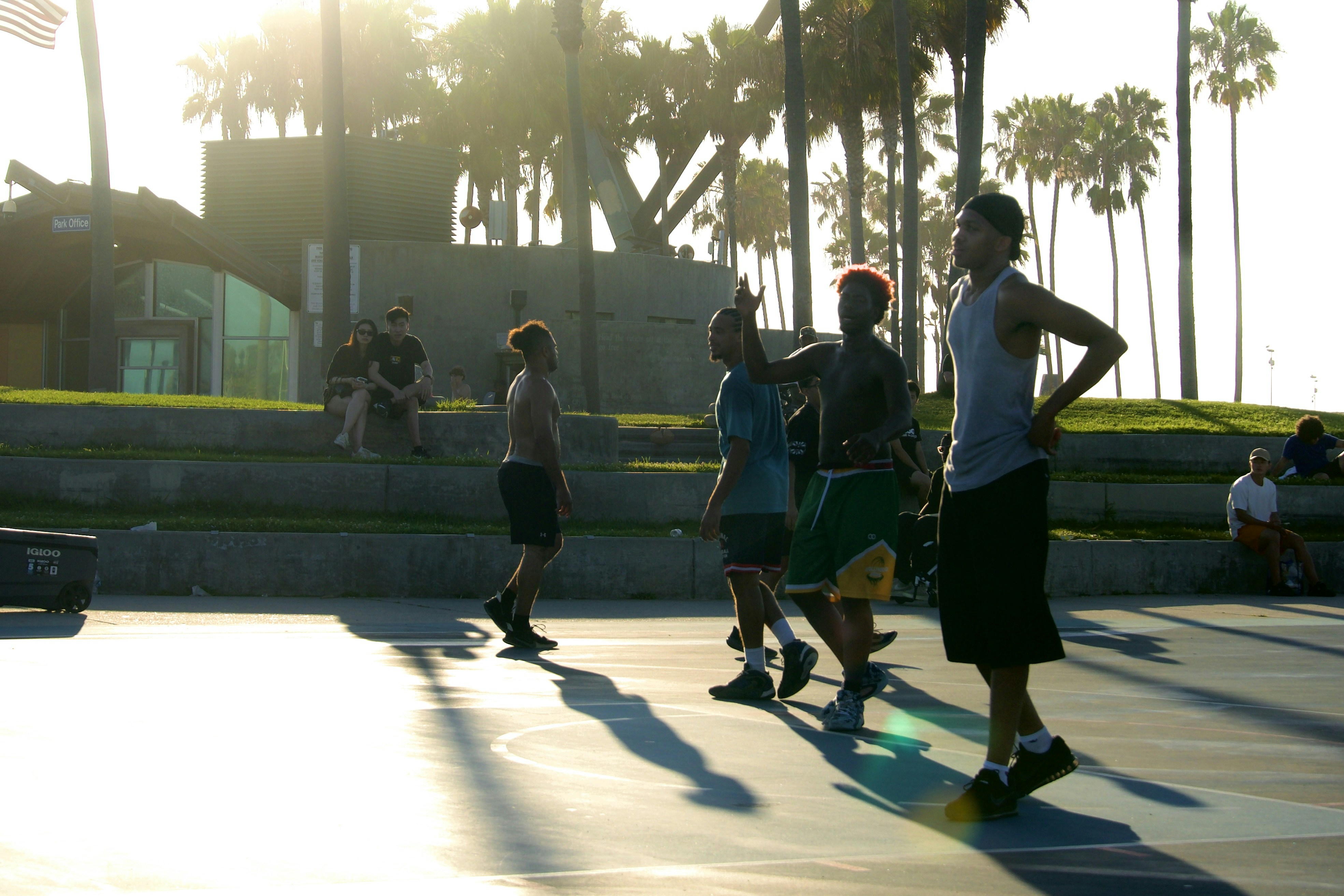 Sunlit Court: A Row of Players Stretches Across the Track
