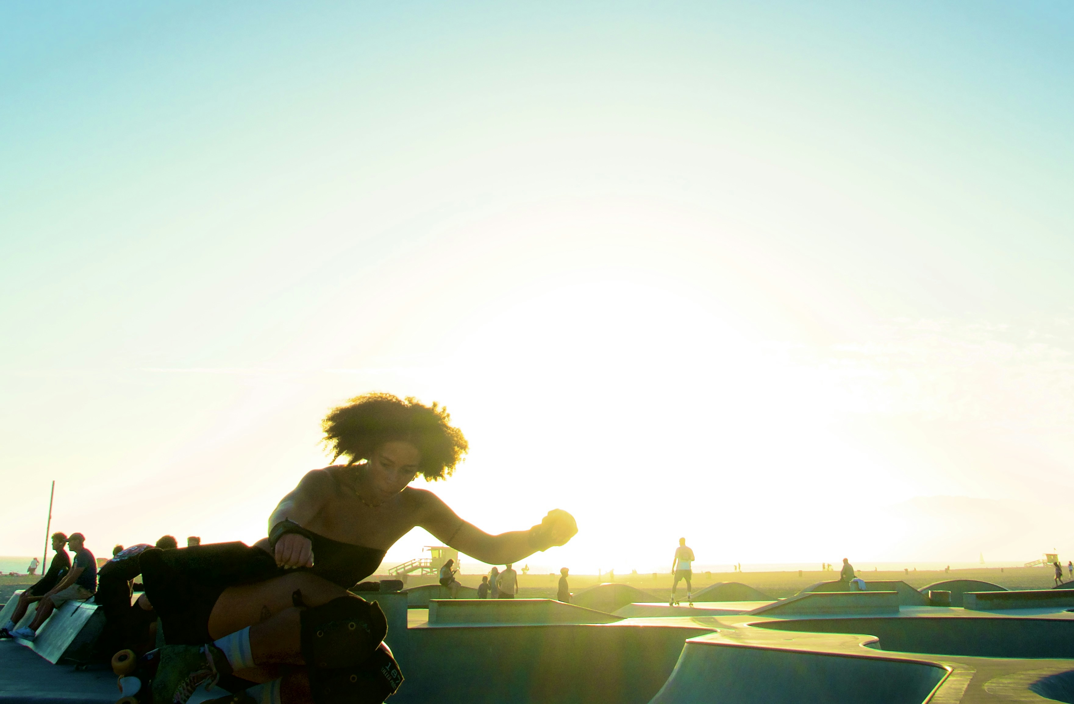 Sunlit Skatepark Shift: A Moment of Motion at Golden Hour