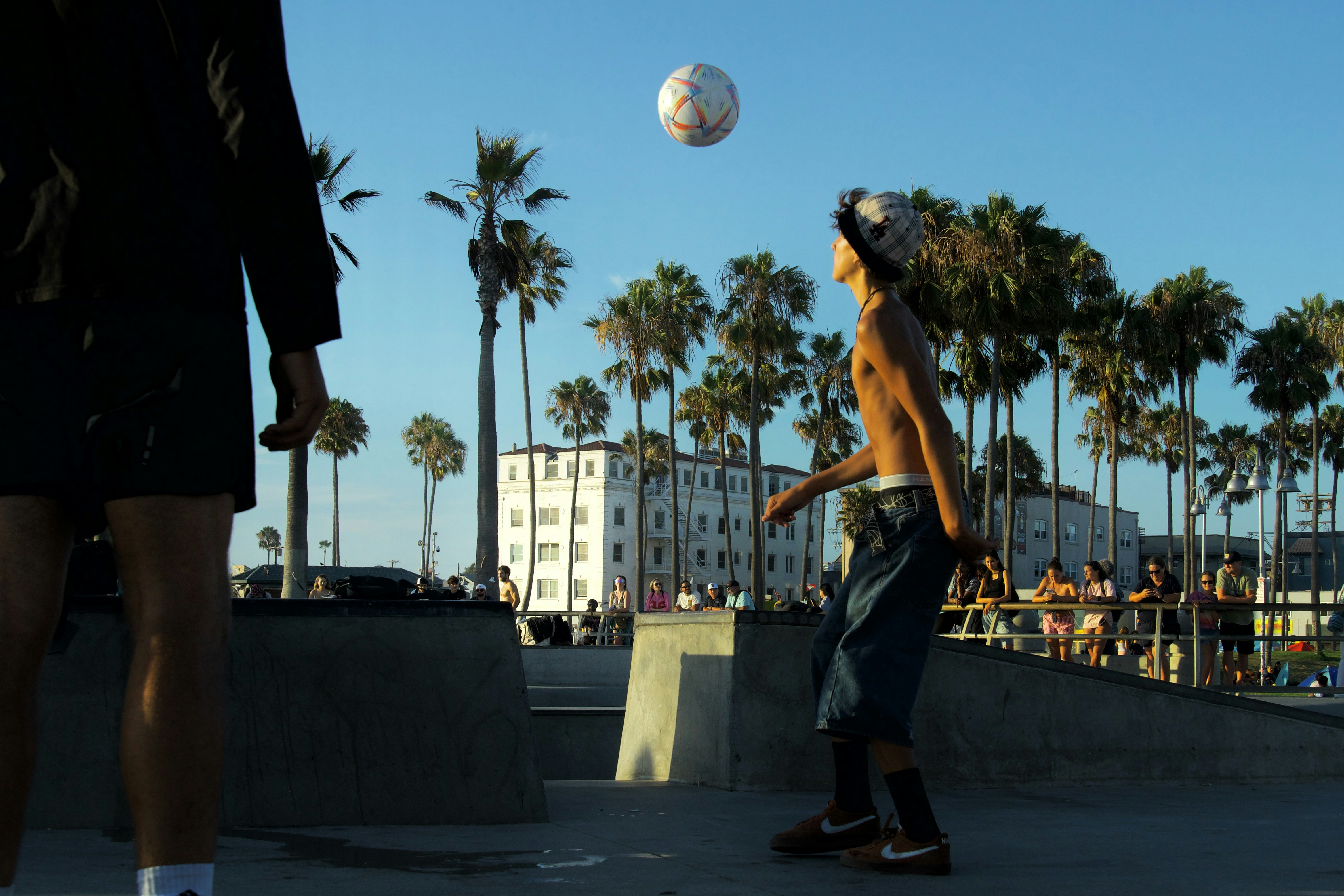 Sunlit Keeper: A Beachside Ball in the Golden Hour