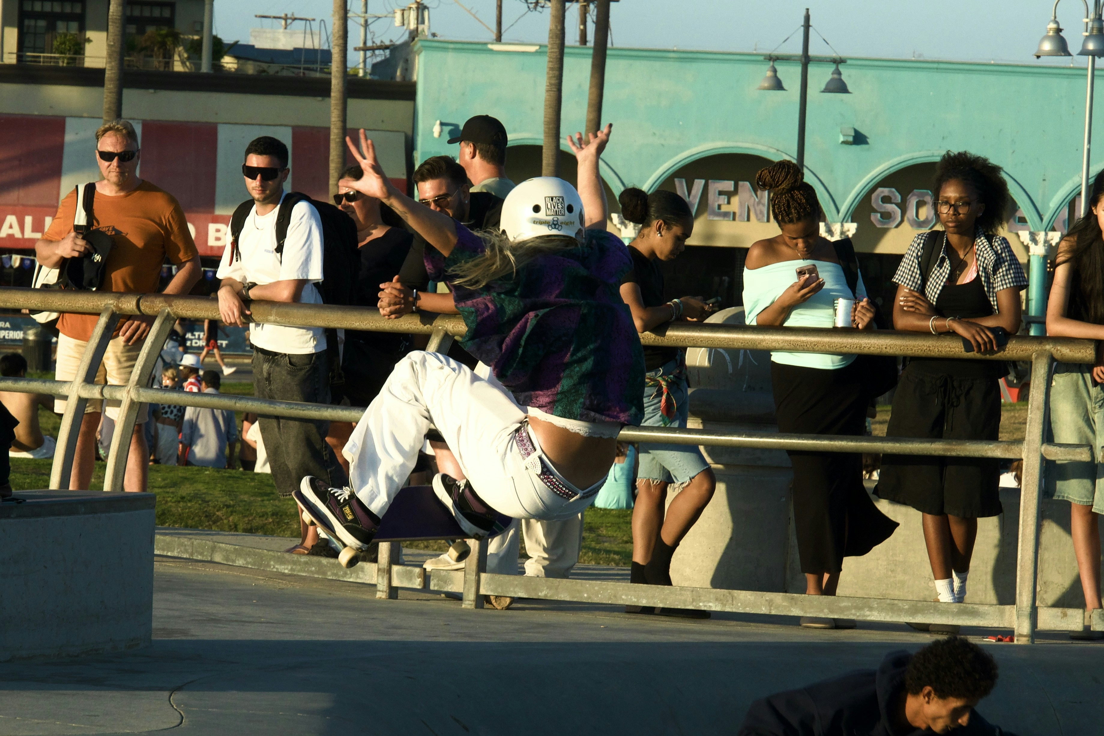 Midair Kickflip at Sunny Boardwalk