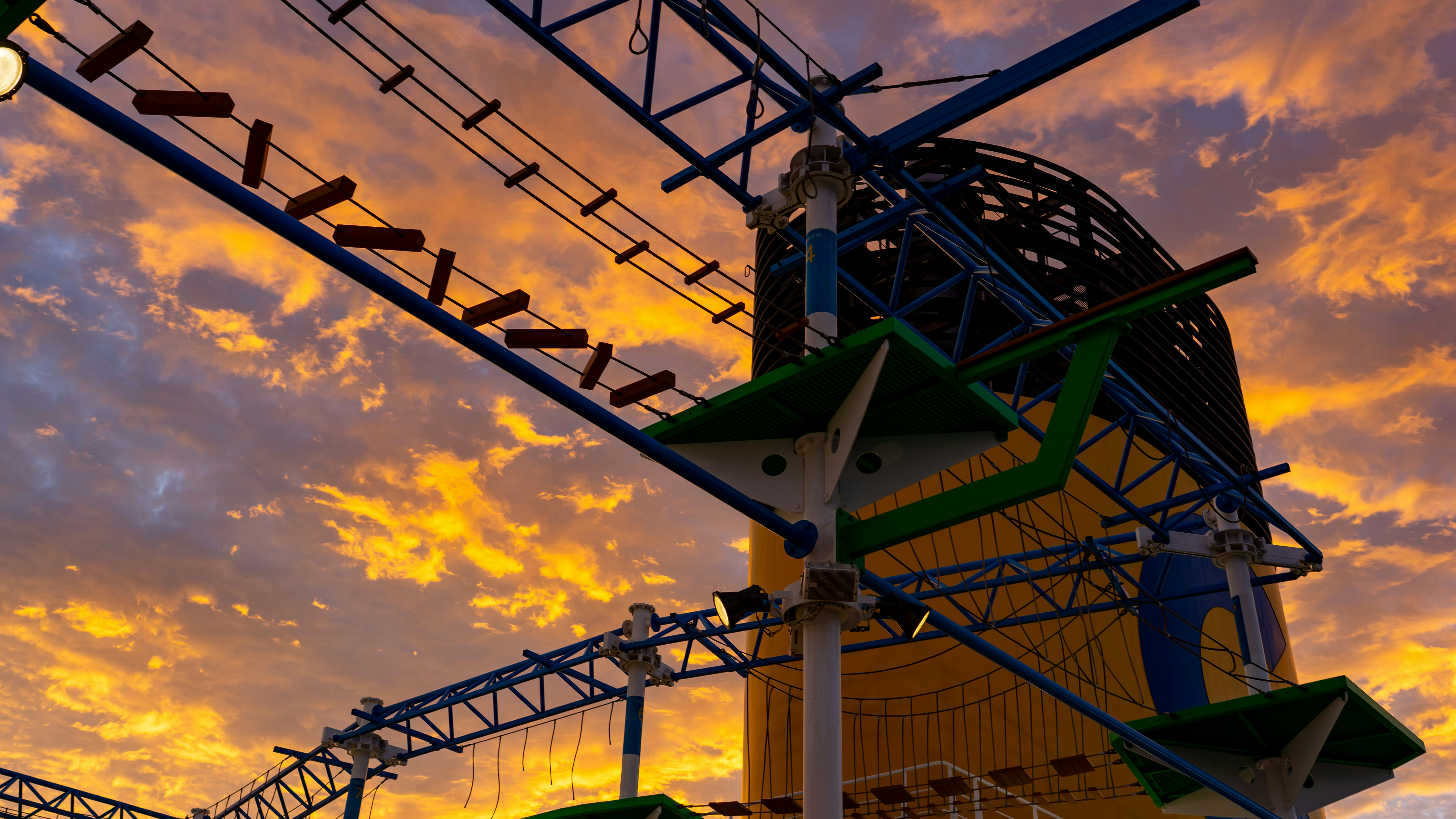 Sunset Over a Helix Structure: Steel Lines Against a Fiery Sky