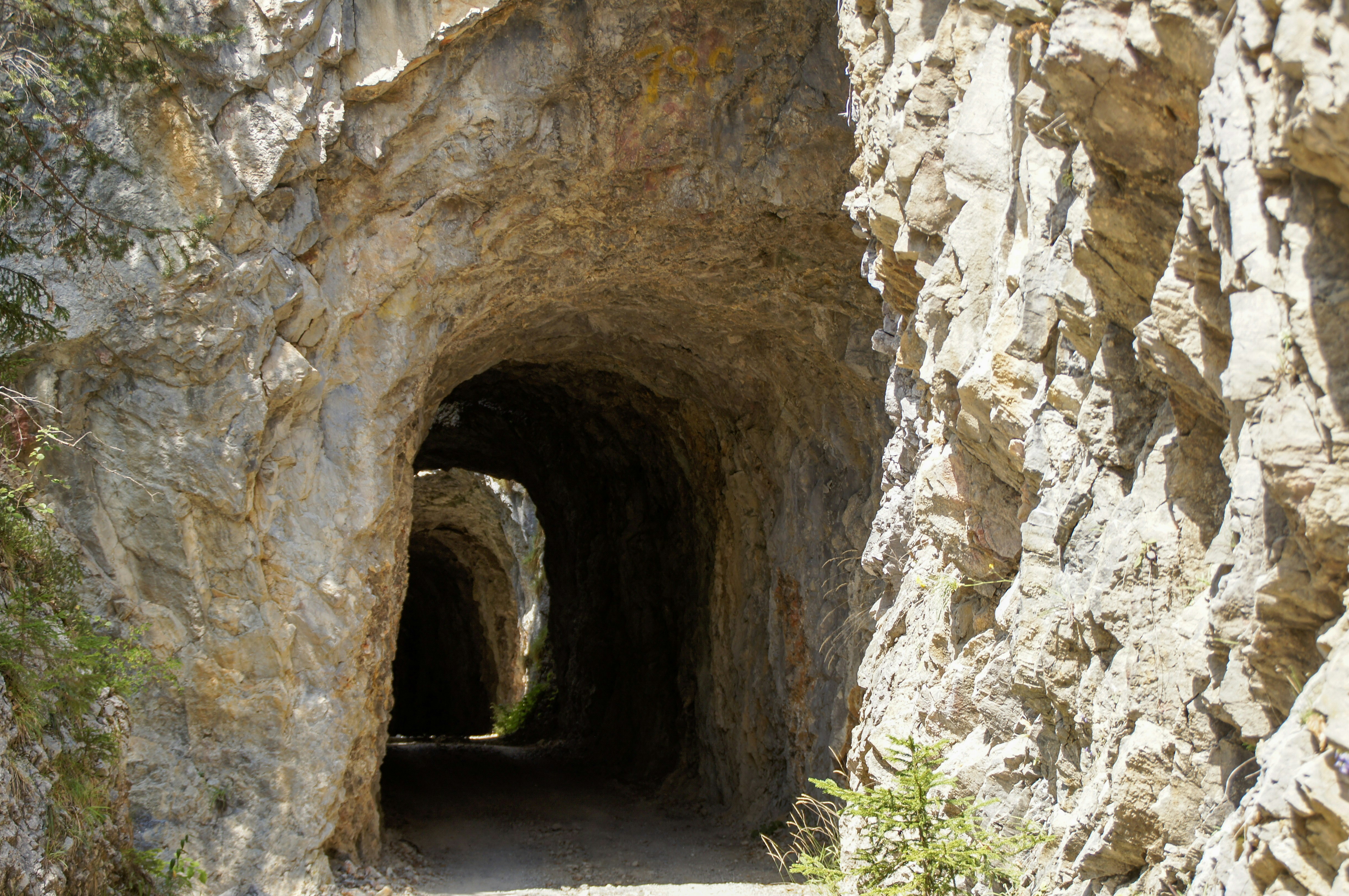 Stone Corridor: Light at the End of a Natural Archway