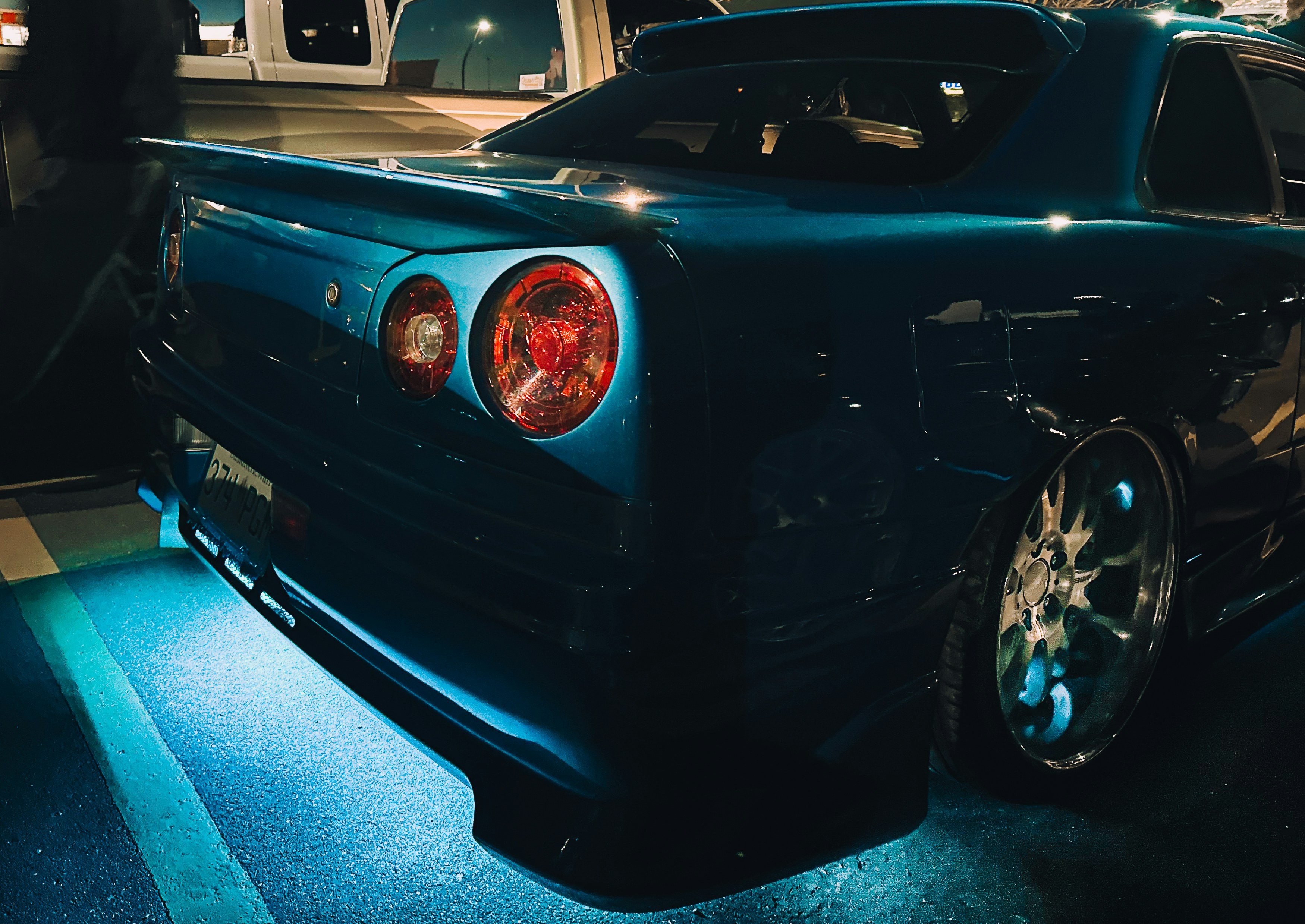 Midnight Blue Muscle: Reflections and Rims at the Car Show