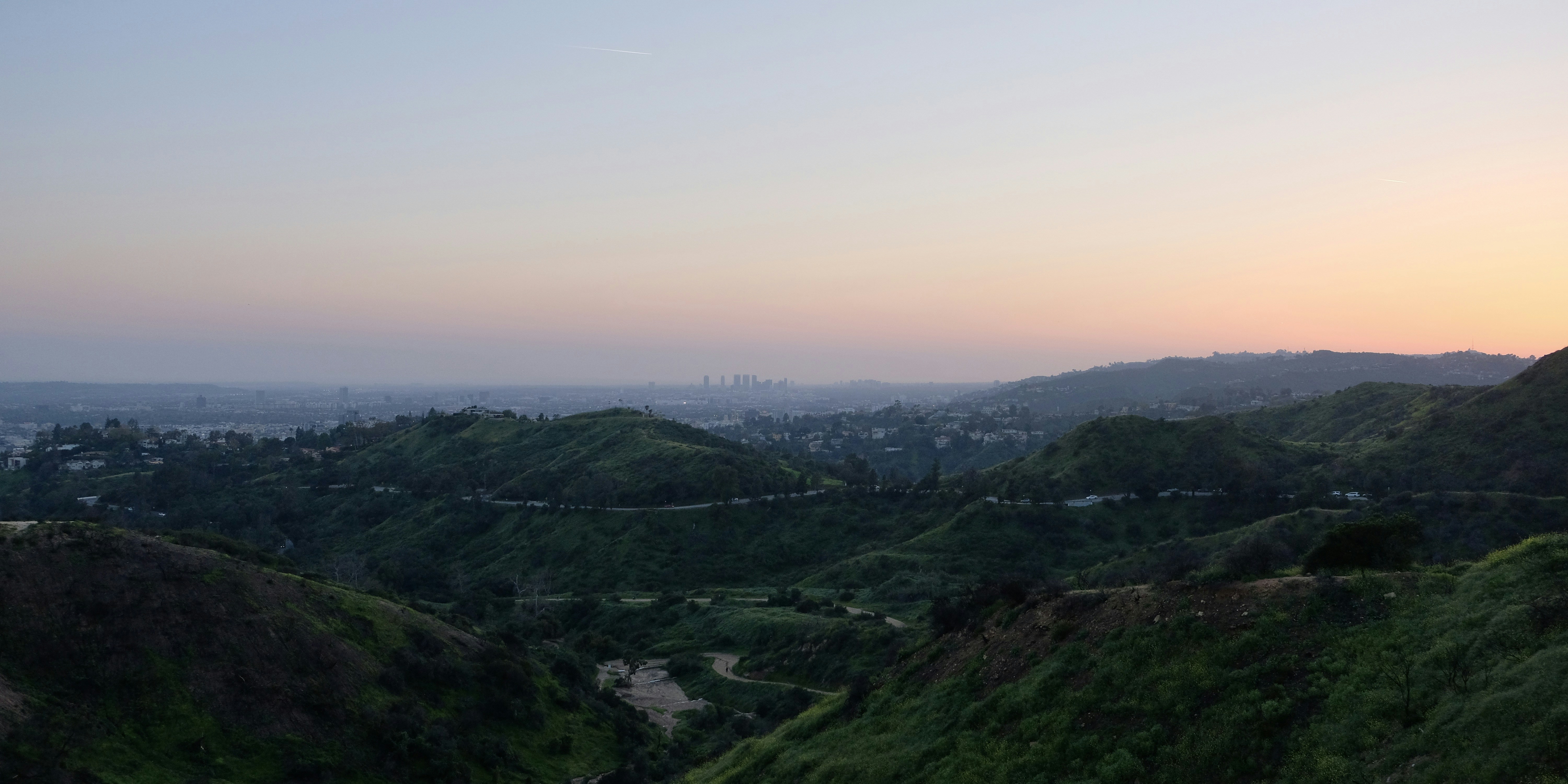 Hillside Veil: Sunset over the Valley