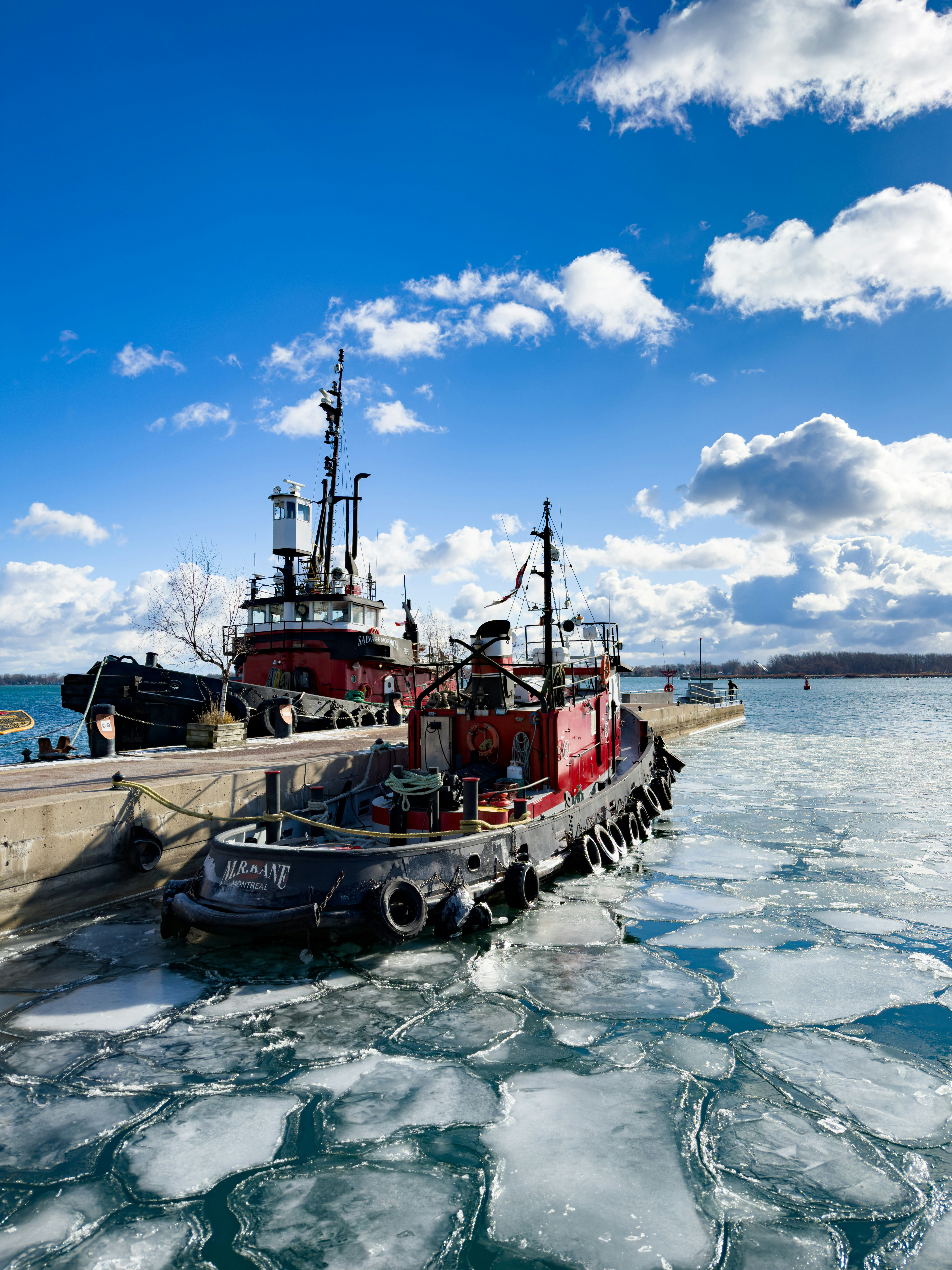 Red Tugboat at Fractured Ice by the Pier