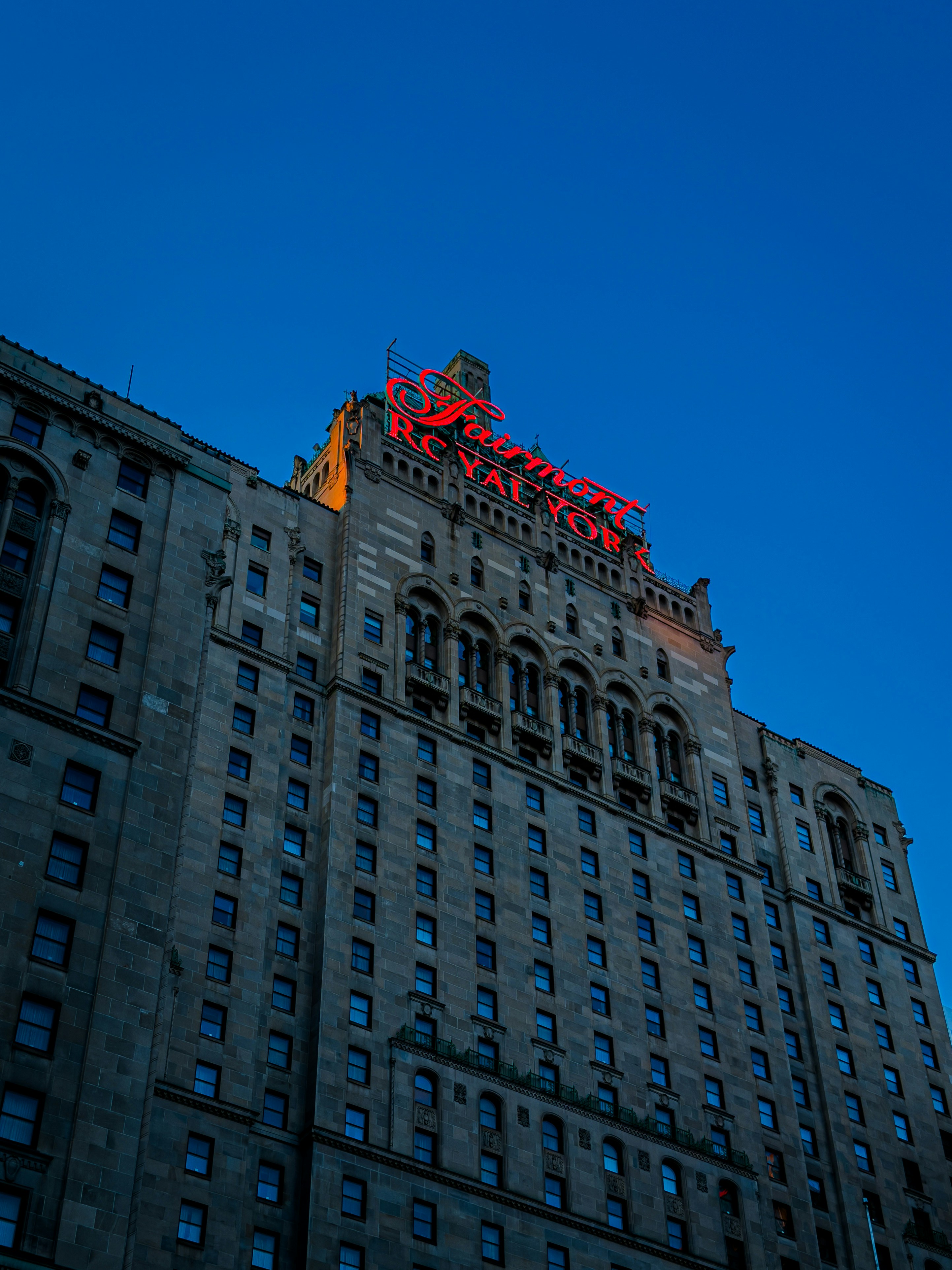 Neon Sign Over the Spires: The Grand Elevation