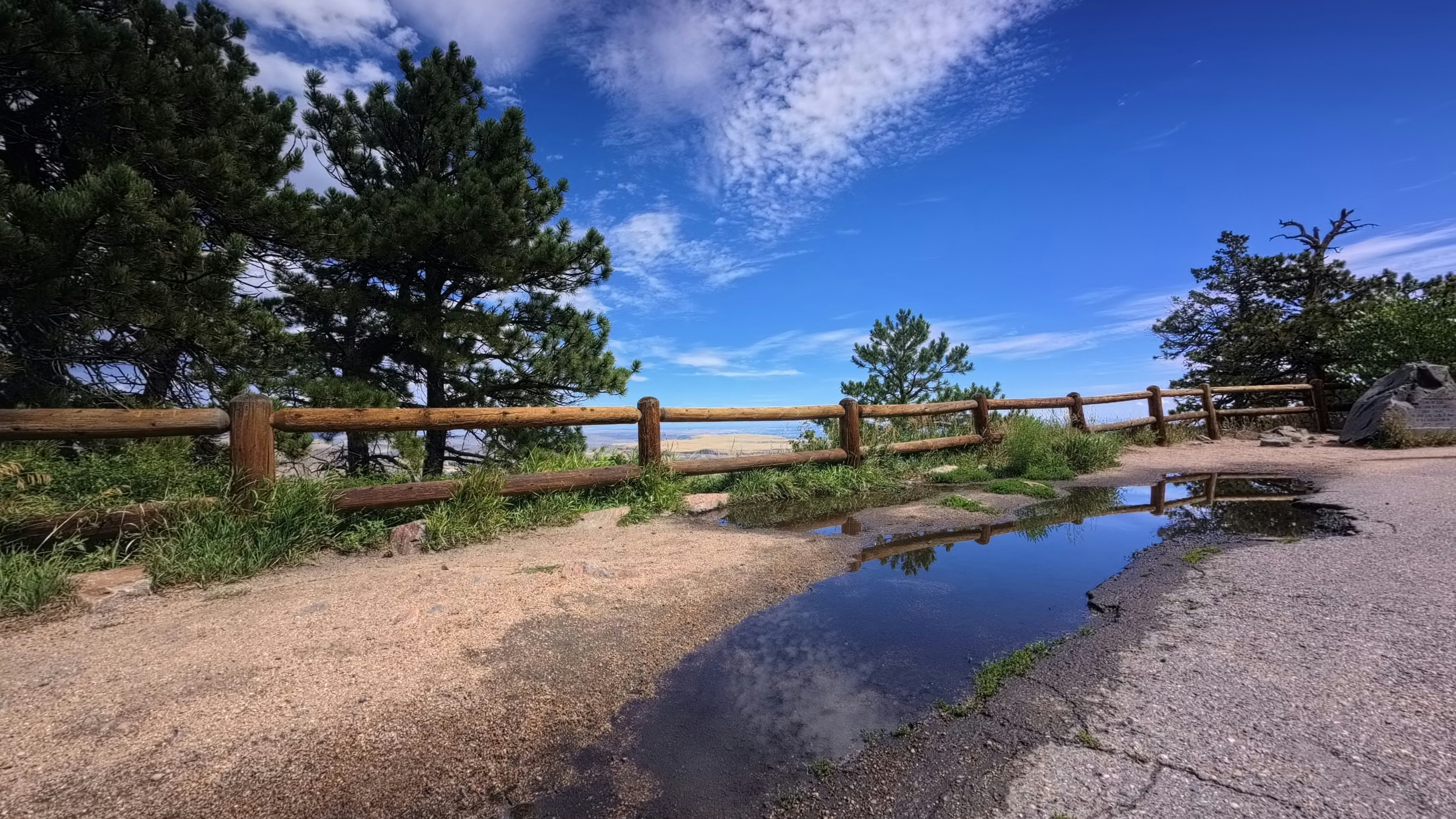 Overlooked Path: A Quiet Rim with Reflections and Pine