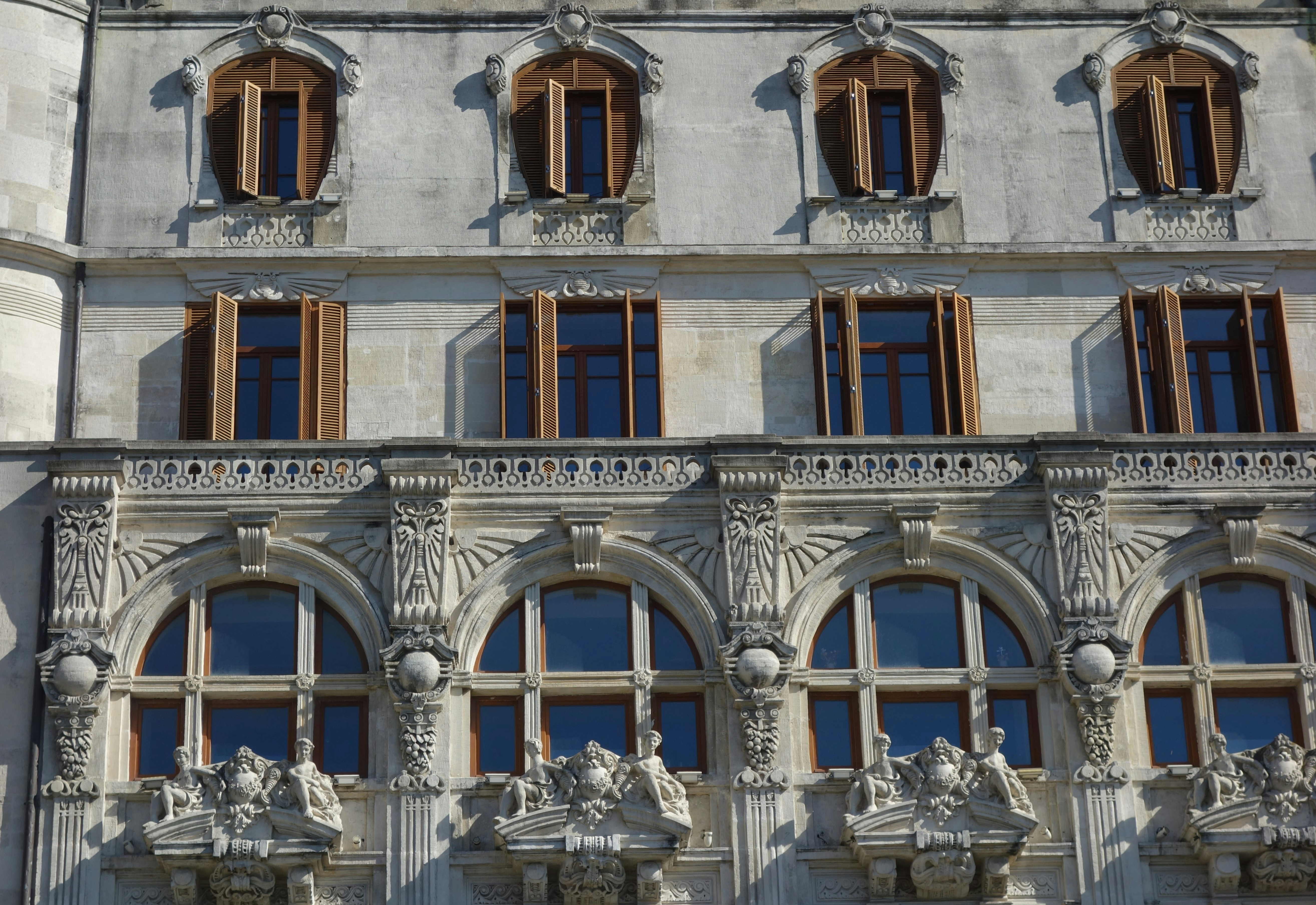 Ornate Facade in Stone: A Symmetry of Arches and Windows