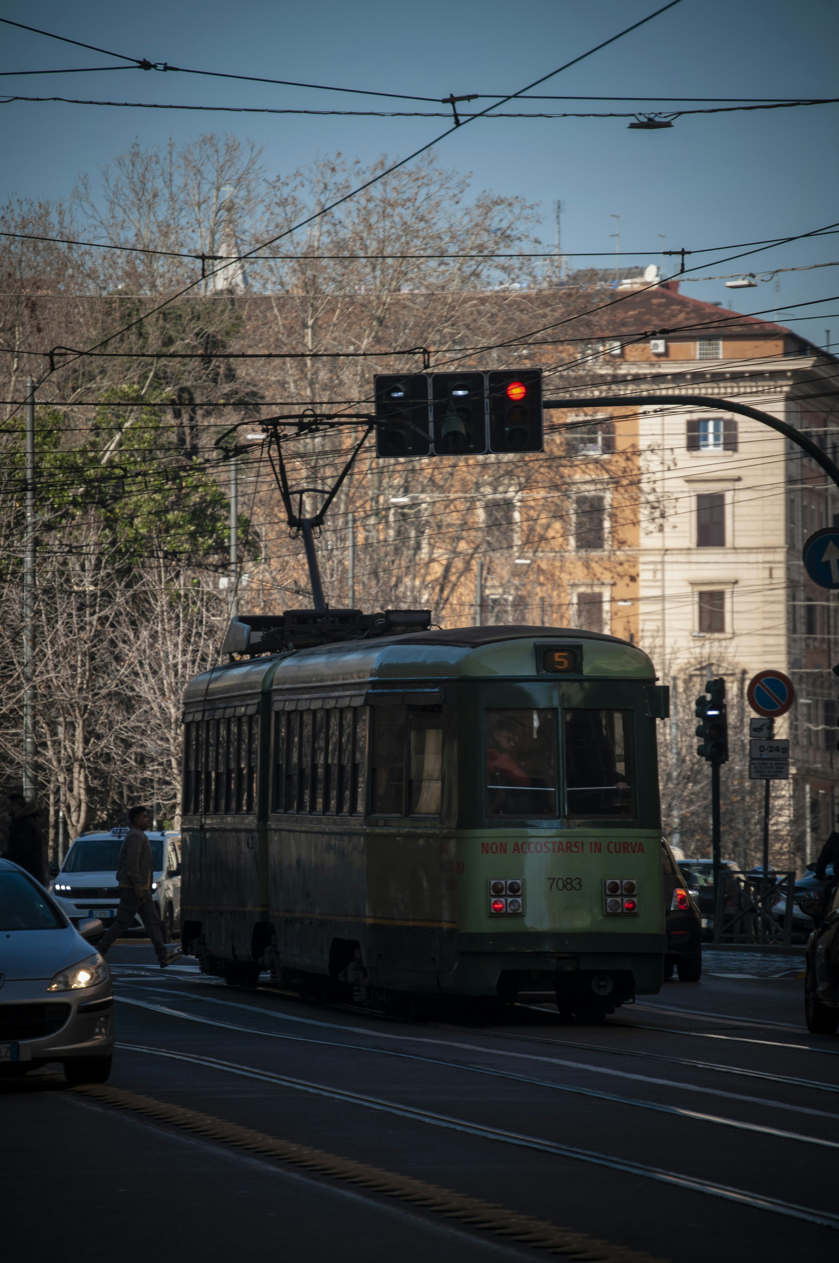 Green Tram in Transit: Streetcar Pulse Through a Sunlit City