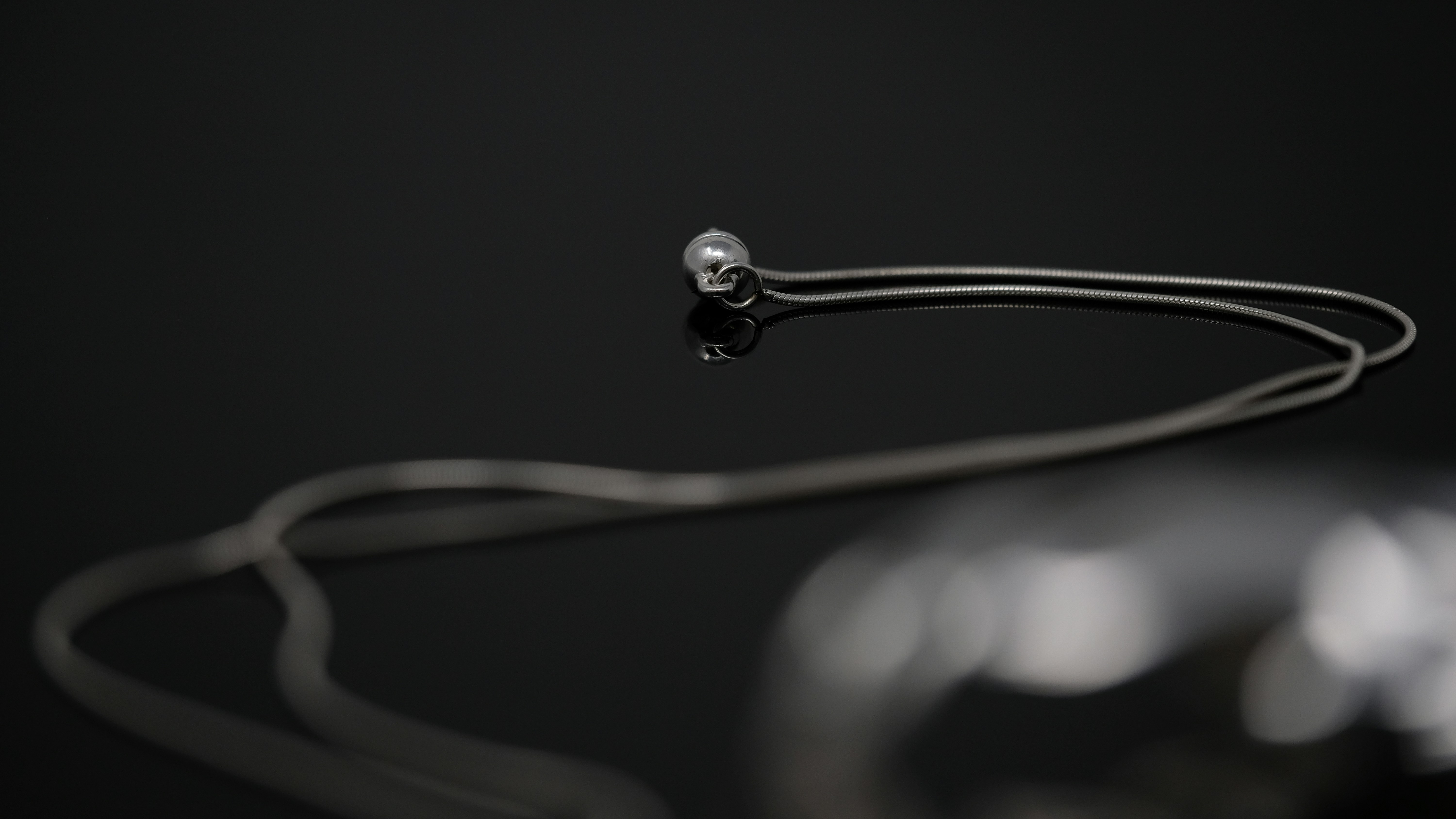 Suspended Shard: A Minimal Wonder of Jewelry on a Velvet Night