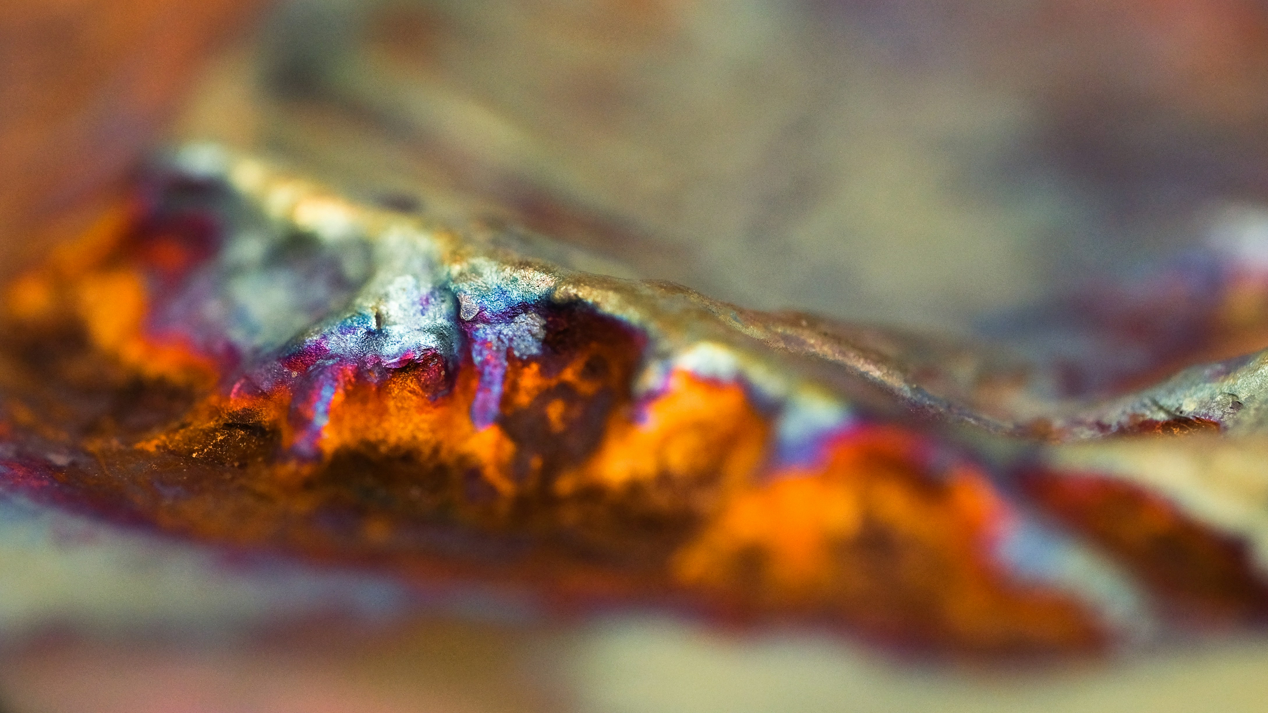 Colorful Rust: Close-up of Iridescent Oxide Ridges