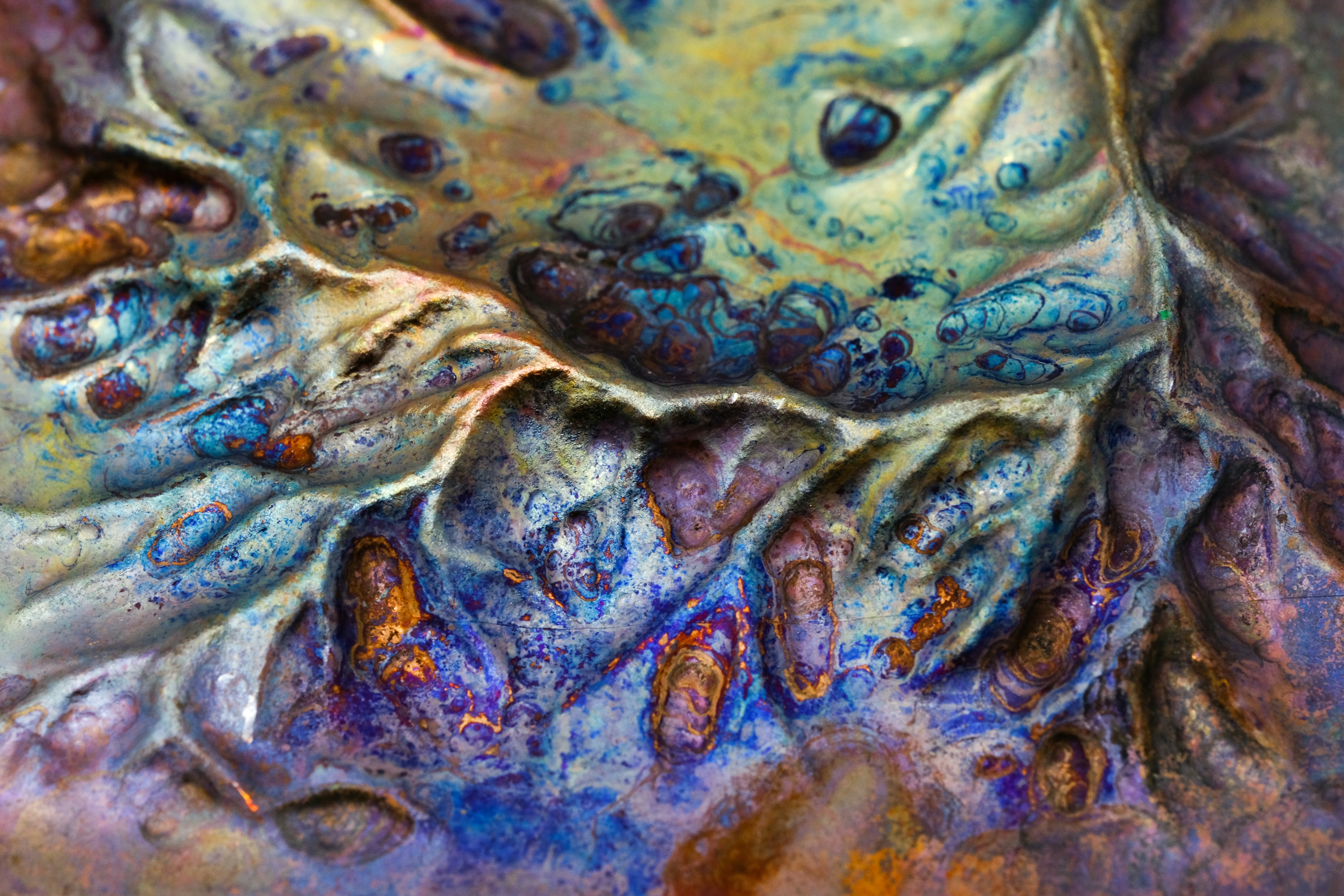 Iridescent Earth: Crumpled Colorways Under a Vein of Light
