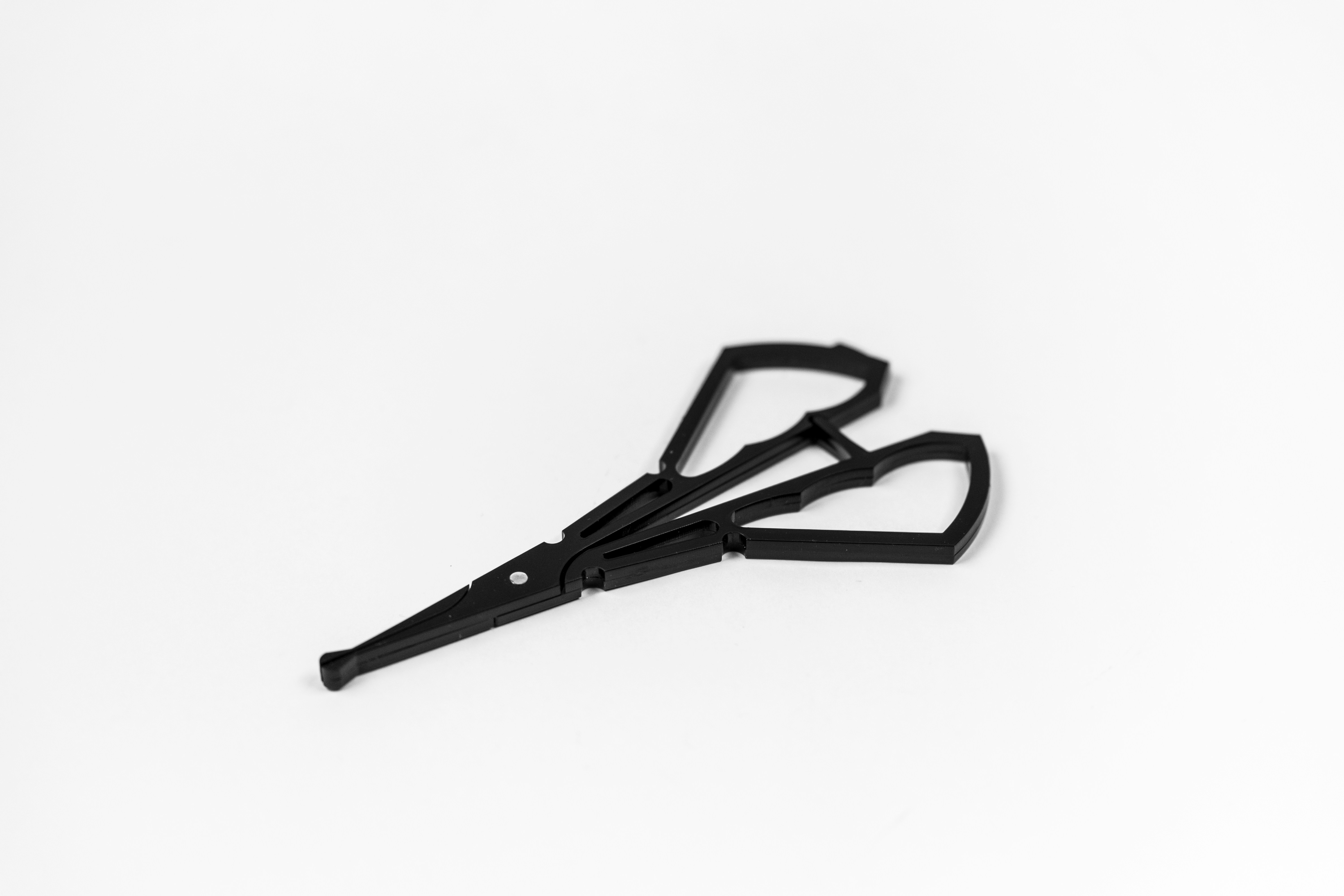 Minimalist Scissors on White: Precision Tools Against Silence