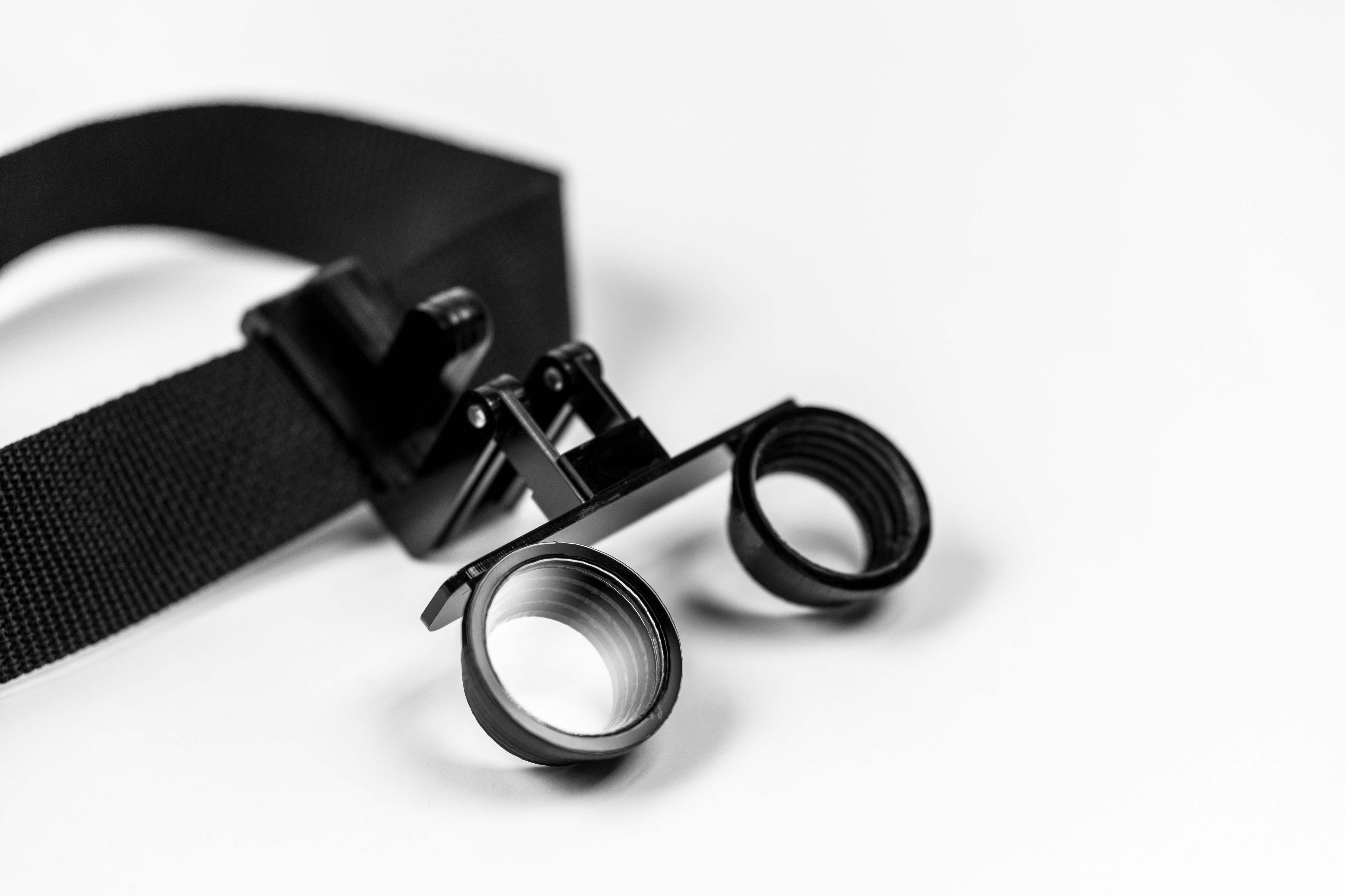 Macro of a Minimal Lens Ring: A Quiet Moment with a Strap and Rings