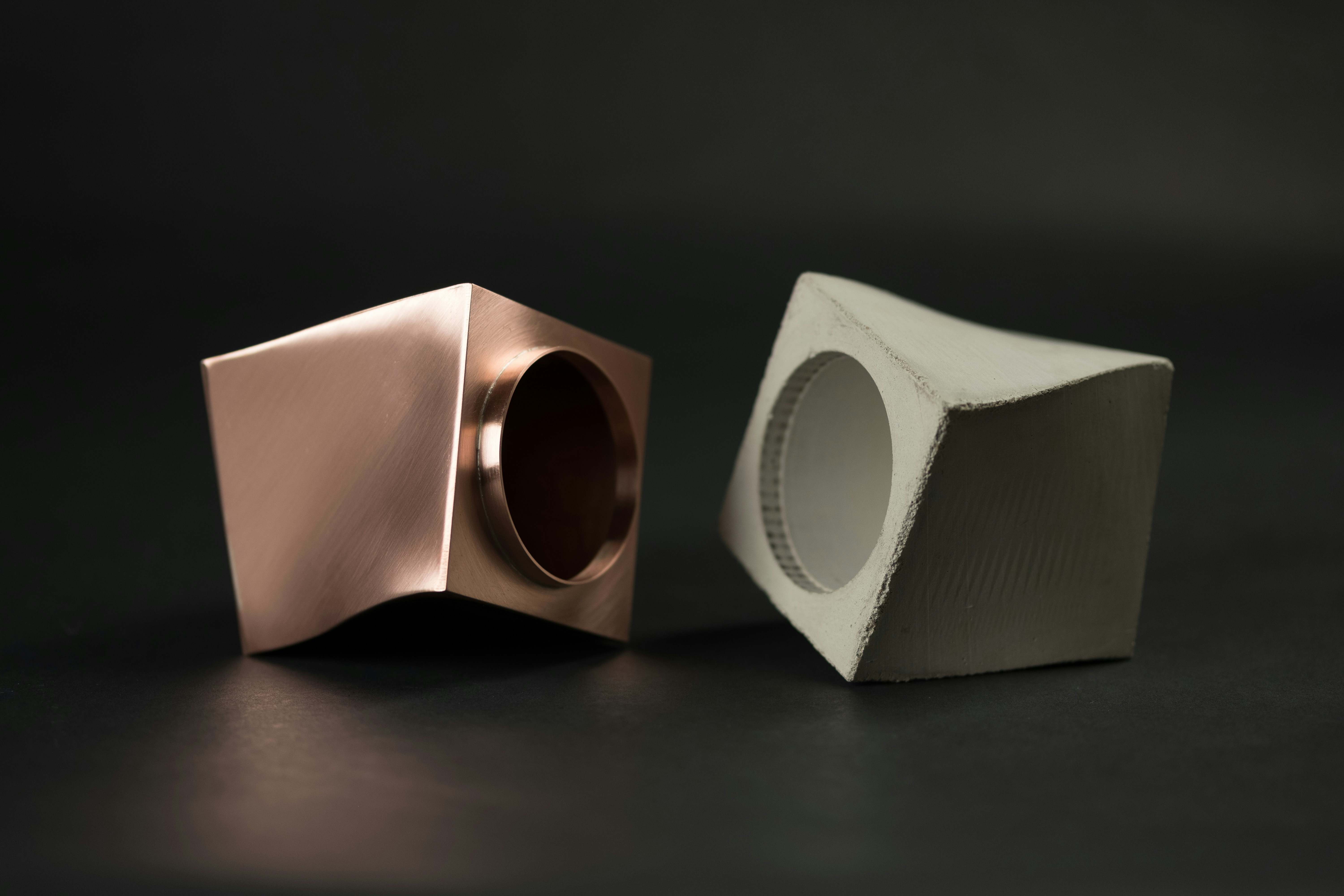 Reflections of Geometry: Copper and Concrete Amidst a Quiet Studio