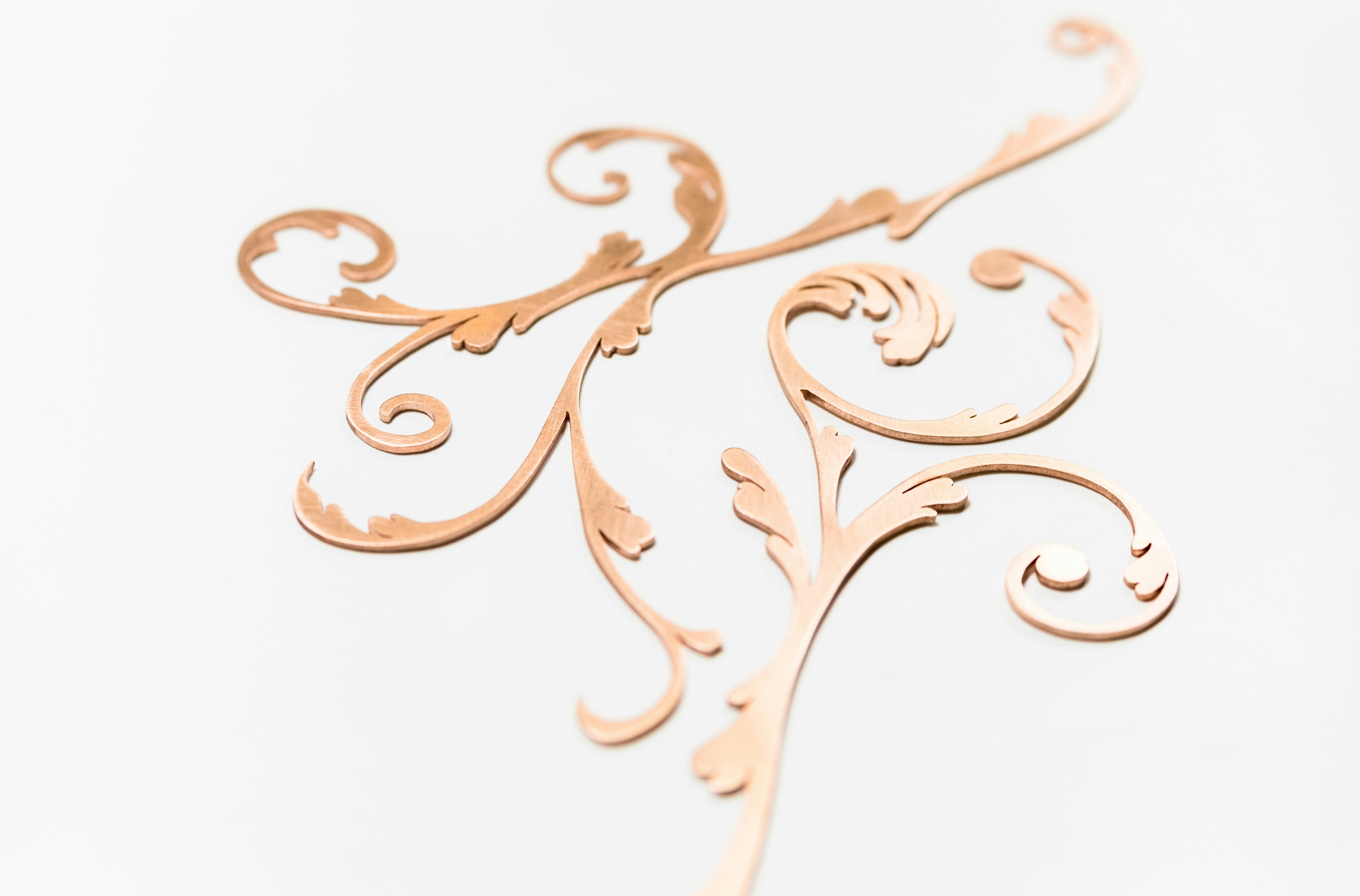 Ornate Copper Ornament in Soft Focus on White