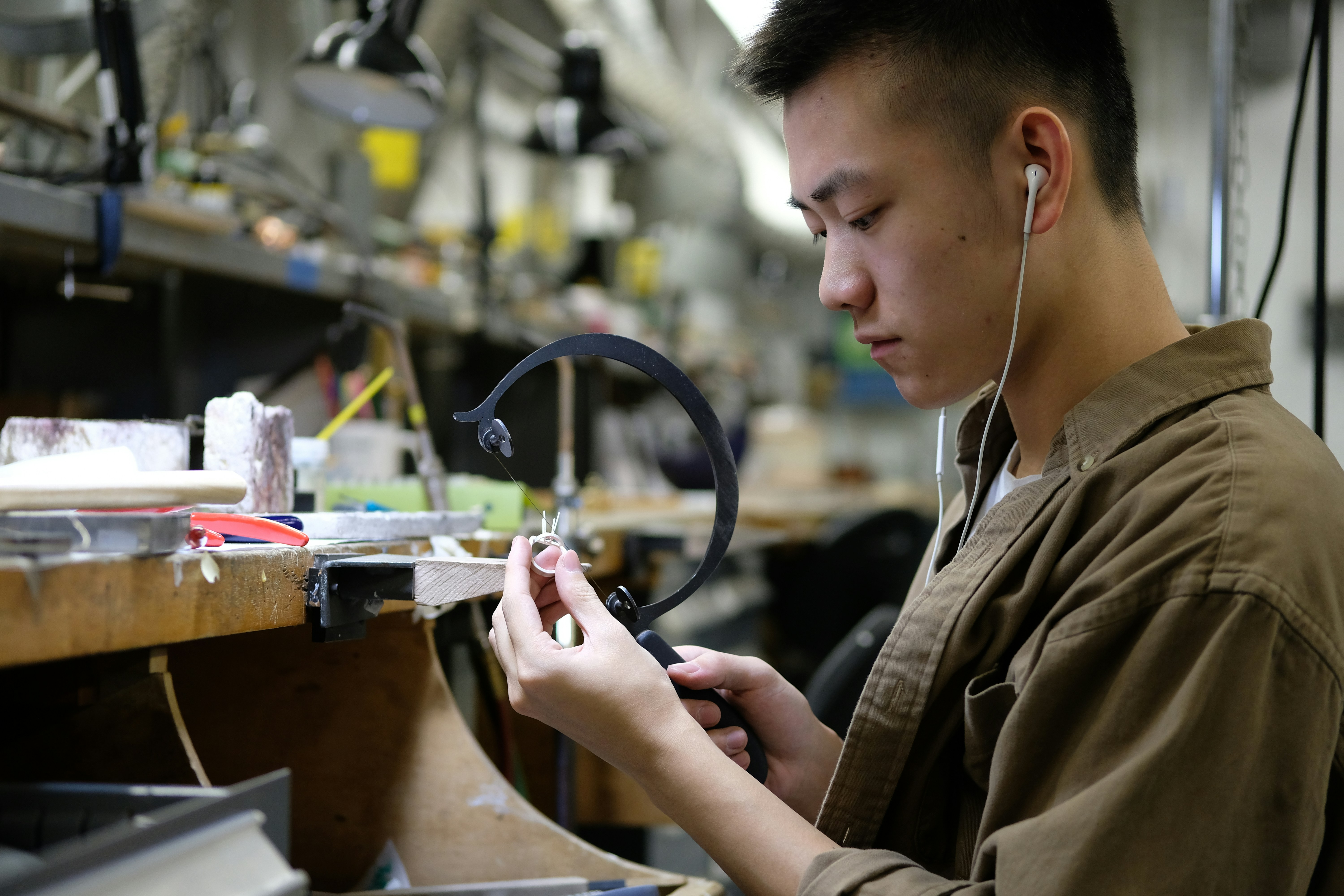 Craftsman at Work: Close-Up of a Ring Processor in a Workshop