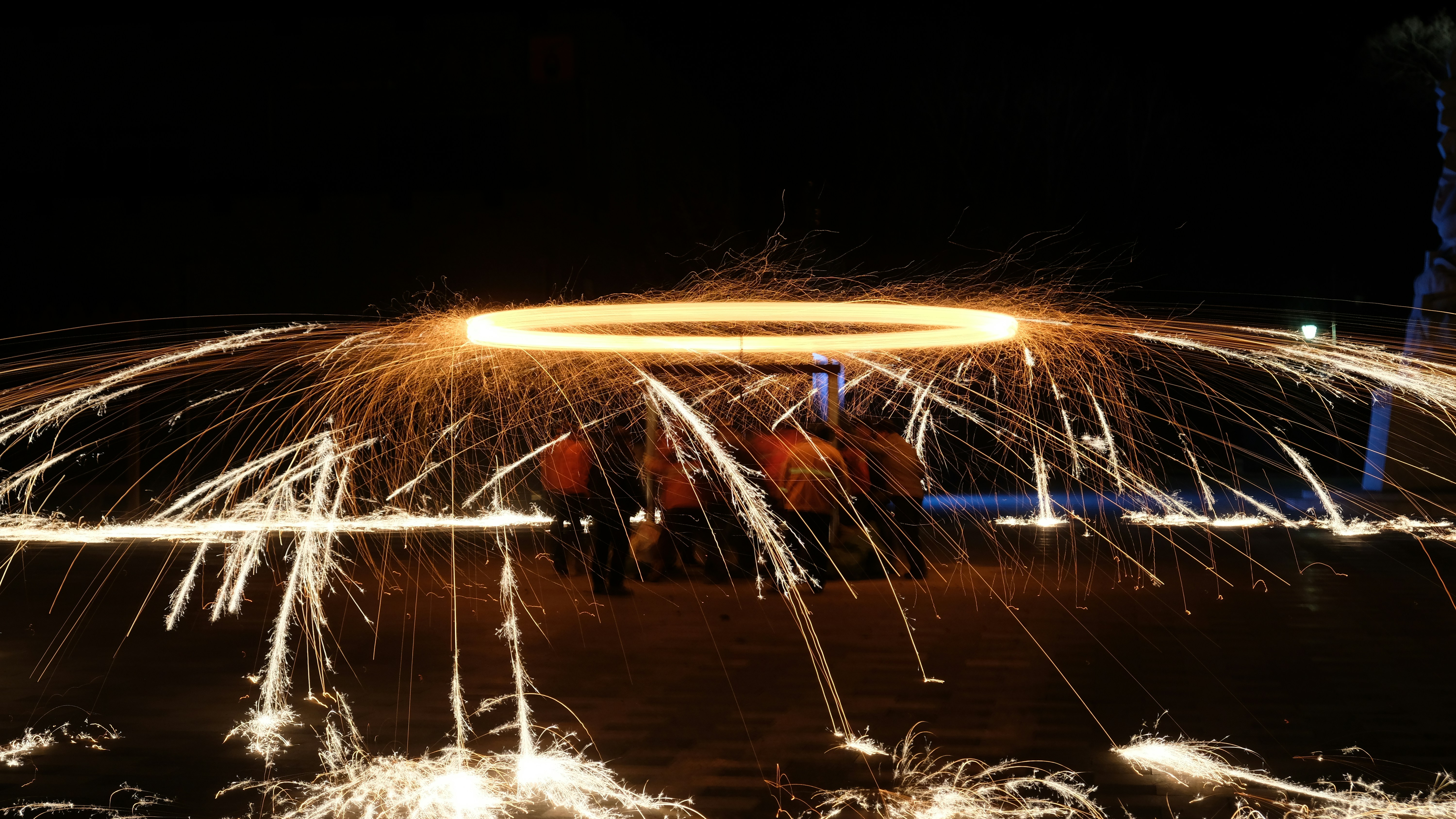 Spinning Sparks Ethereal Ring Over Quiet Night