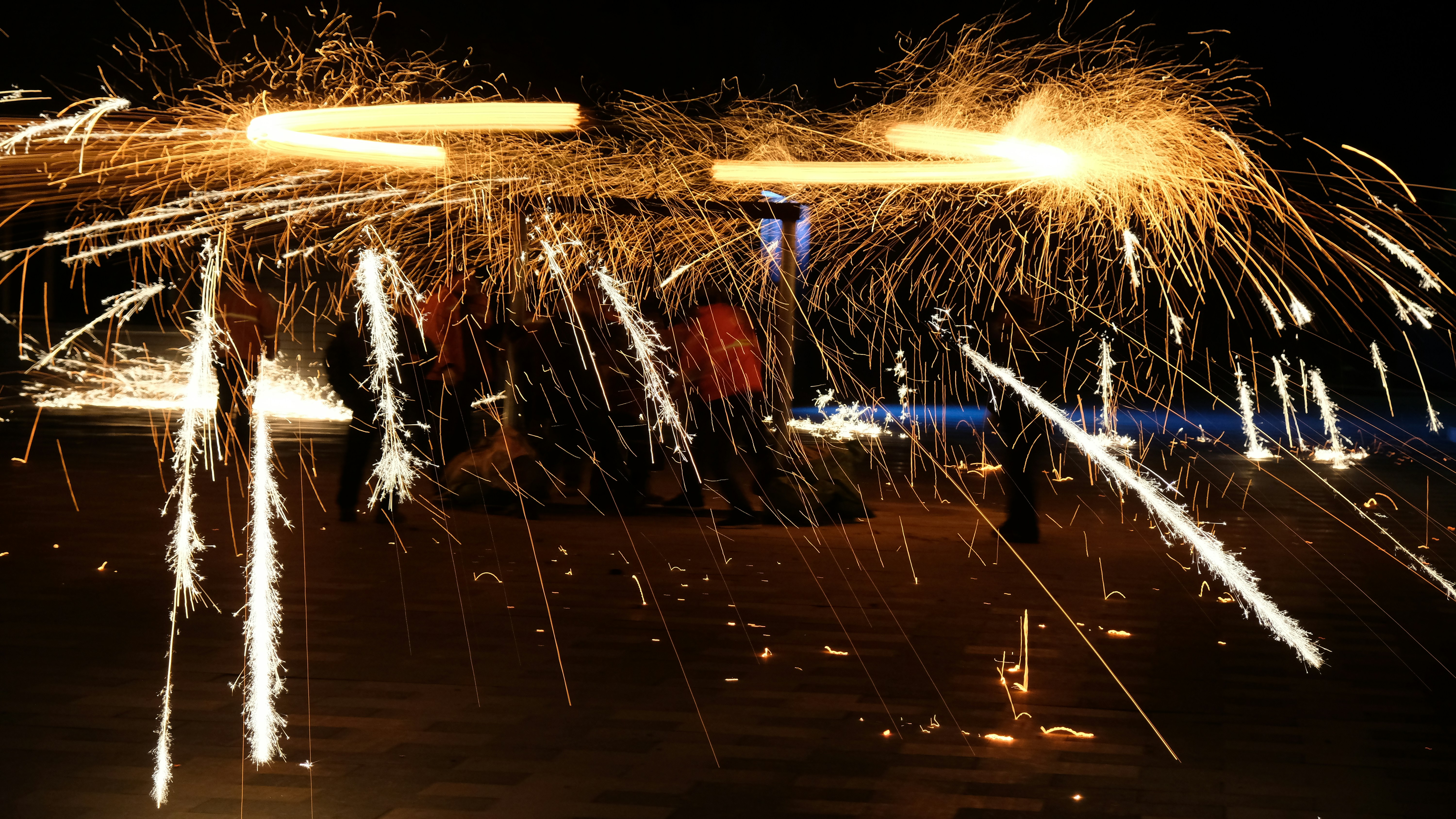 Sparks in Slow Motion: Nighttime Sparkler Dance