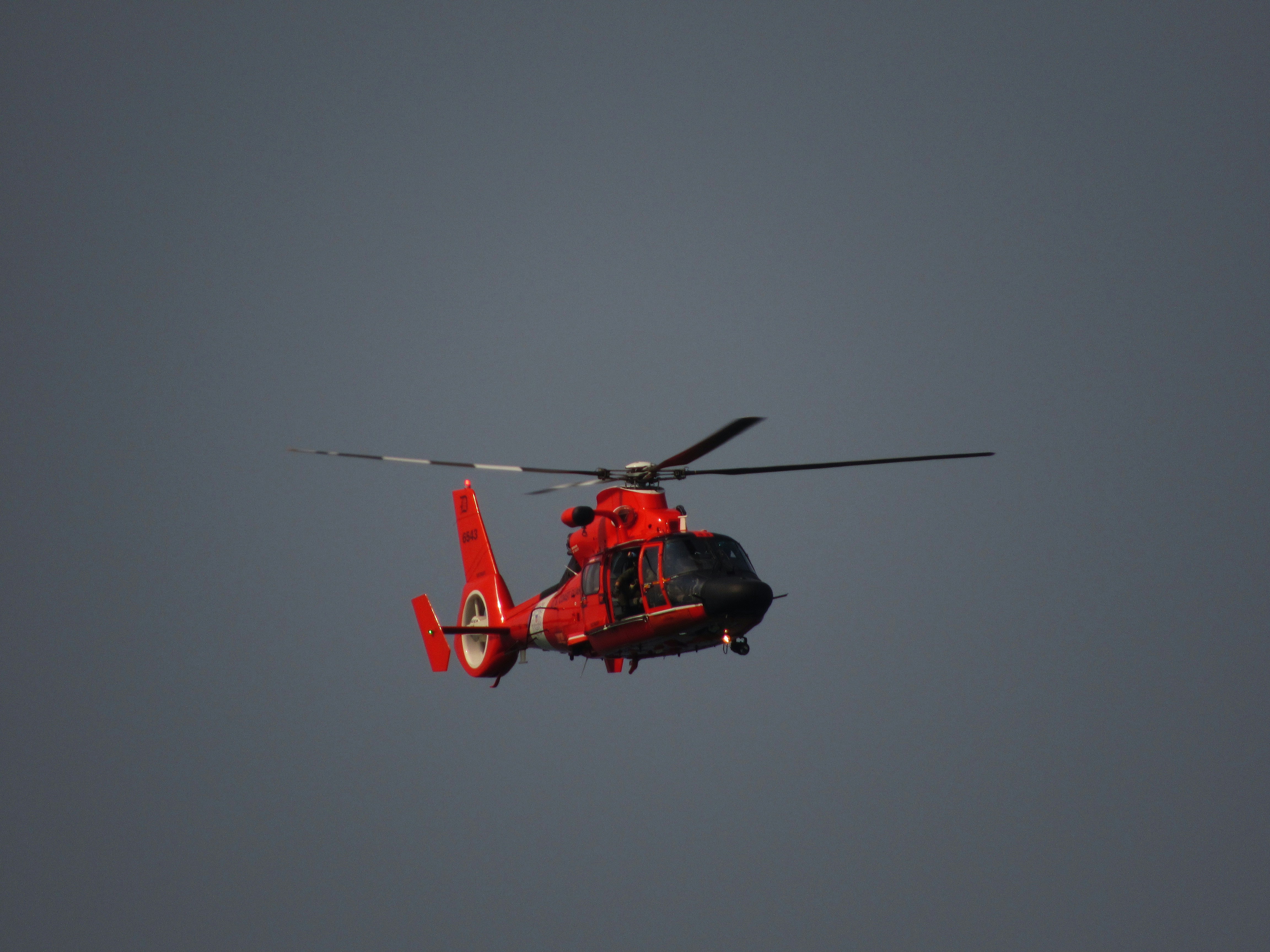 Red Rescue: Aerial Helix in Evening Sky