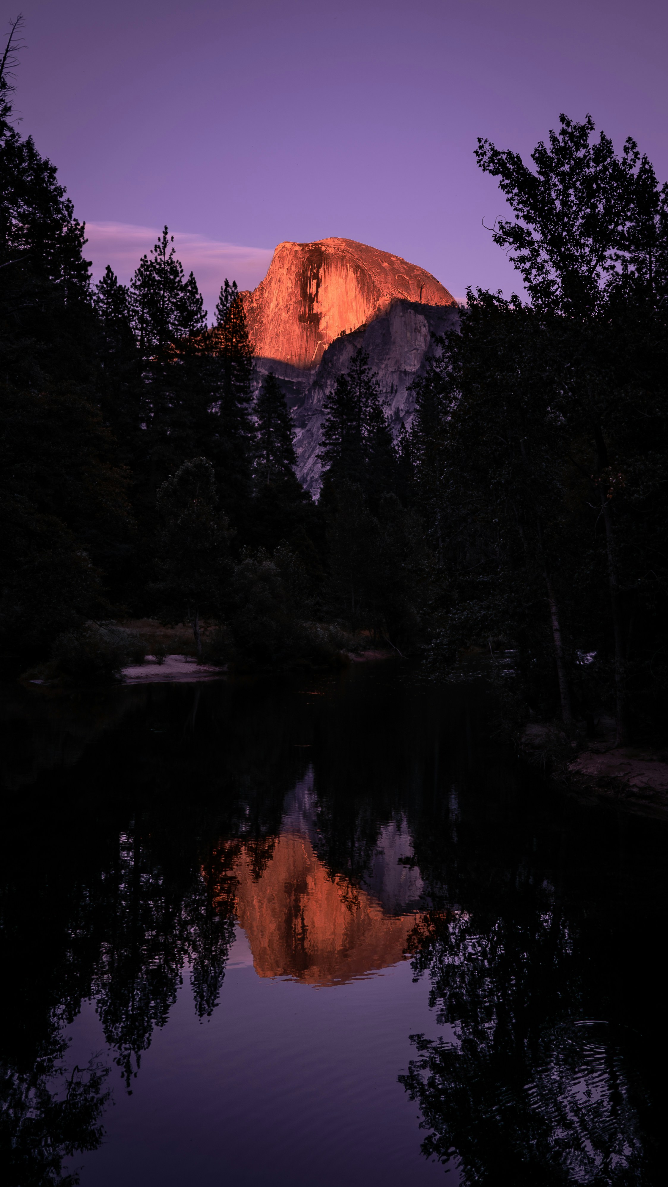 Glow on Half Dome: twilight reflection over still water