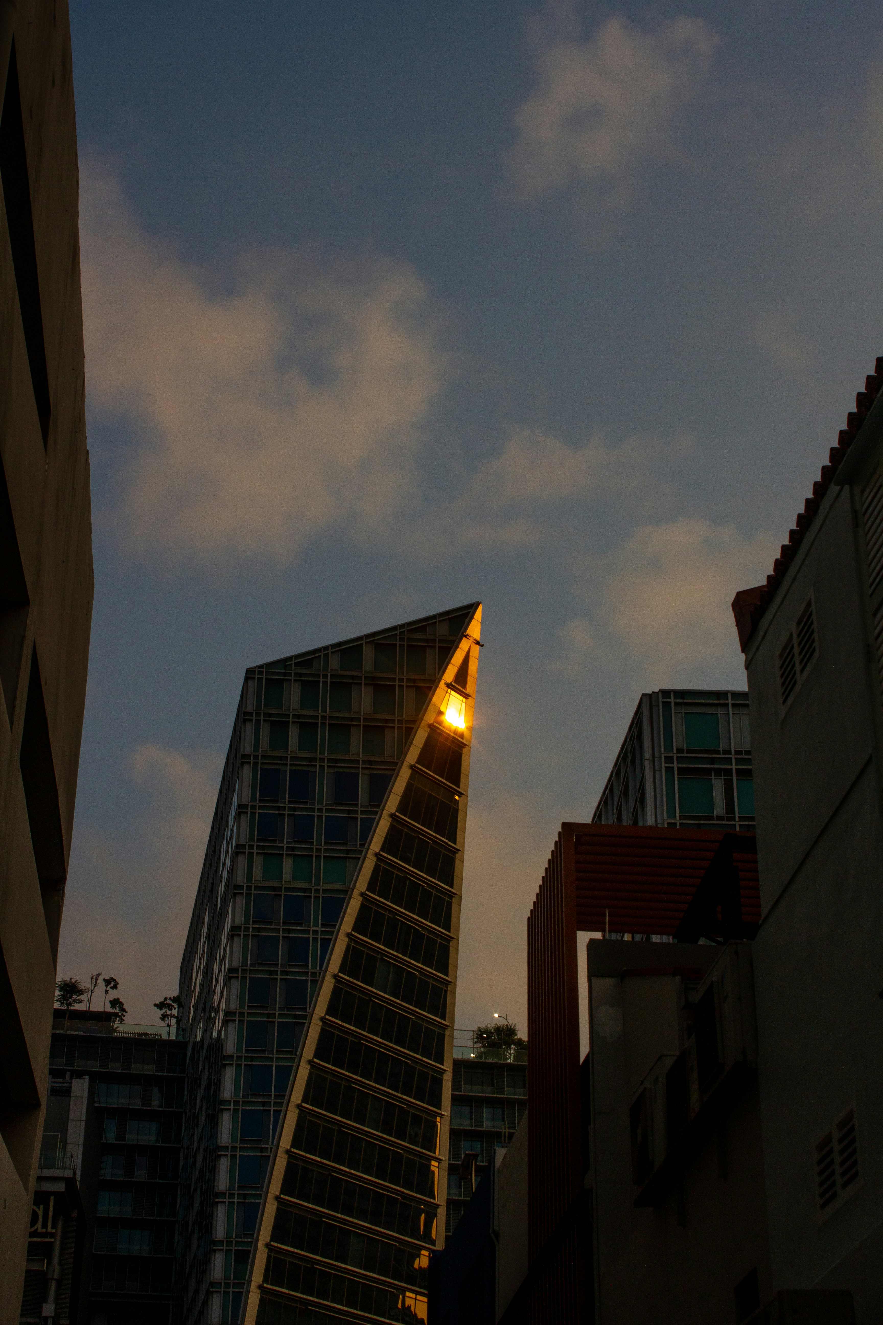 Golden Apex: Sunlit Tip of a Modern Sliver