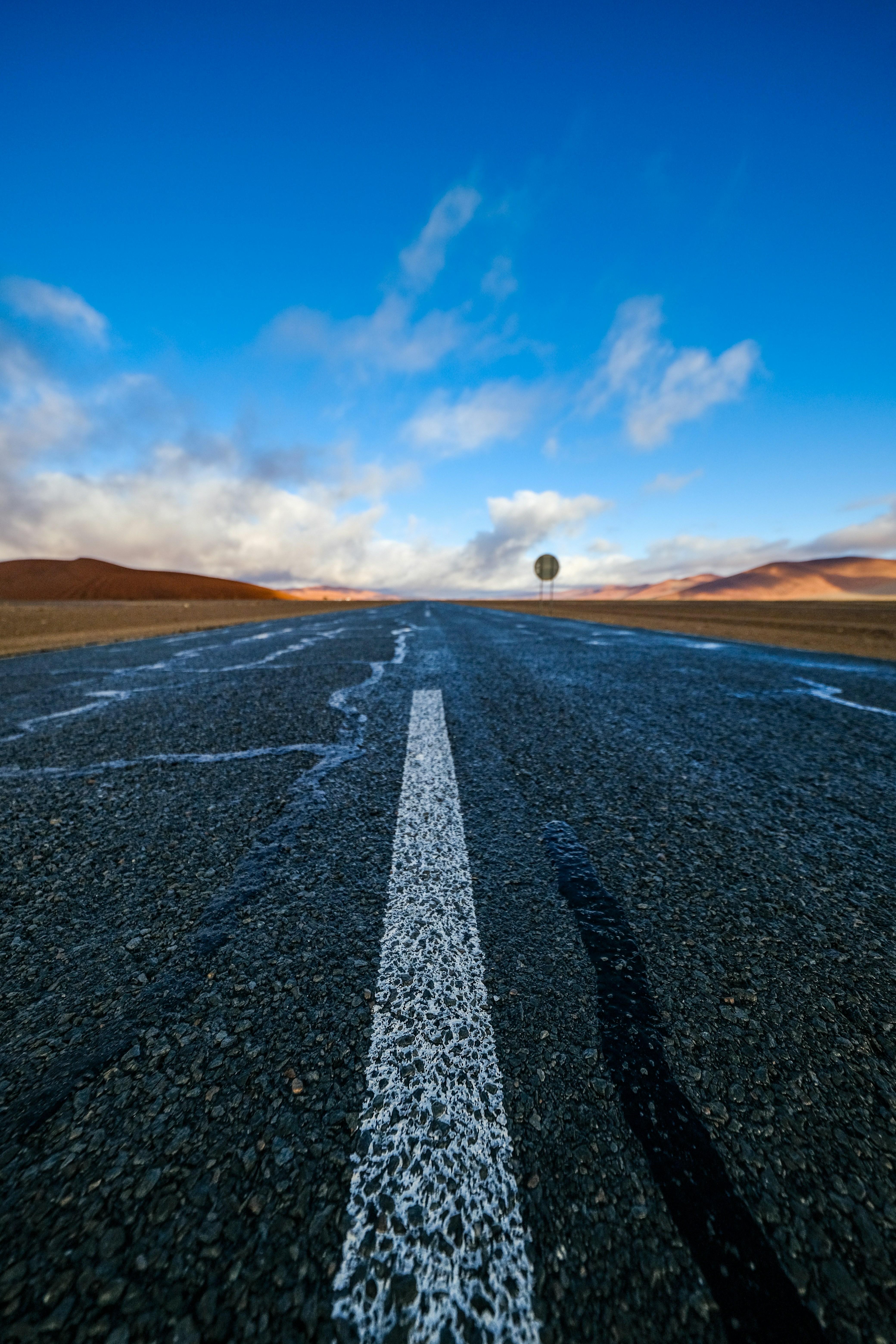 Endless Road under a Wide Blue Sky