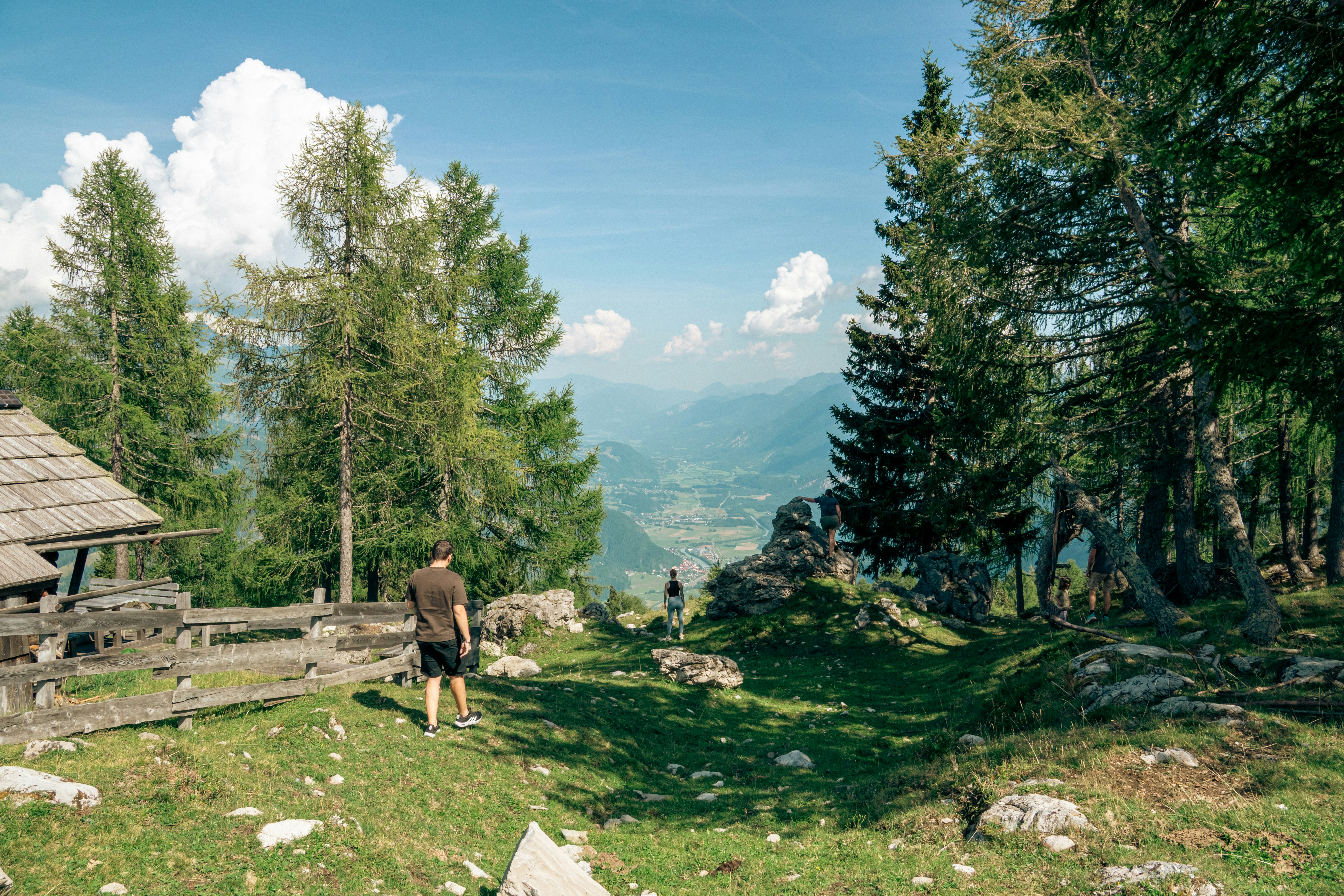  trail to the overlook: hikers against a alpine panorama