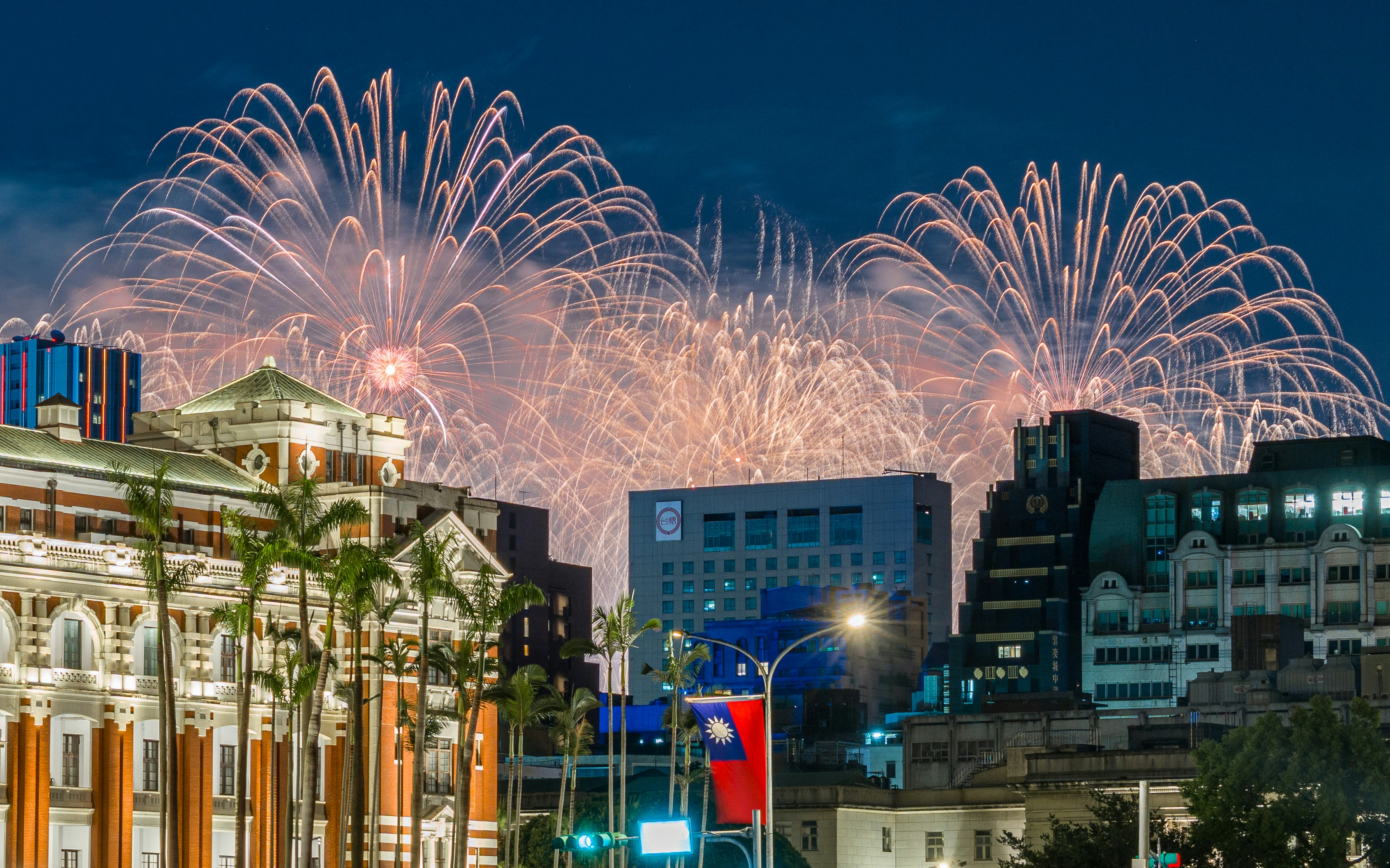 City Lights Under Fireworks: Nighttime Skyline Jubilation