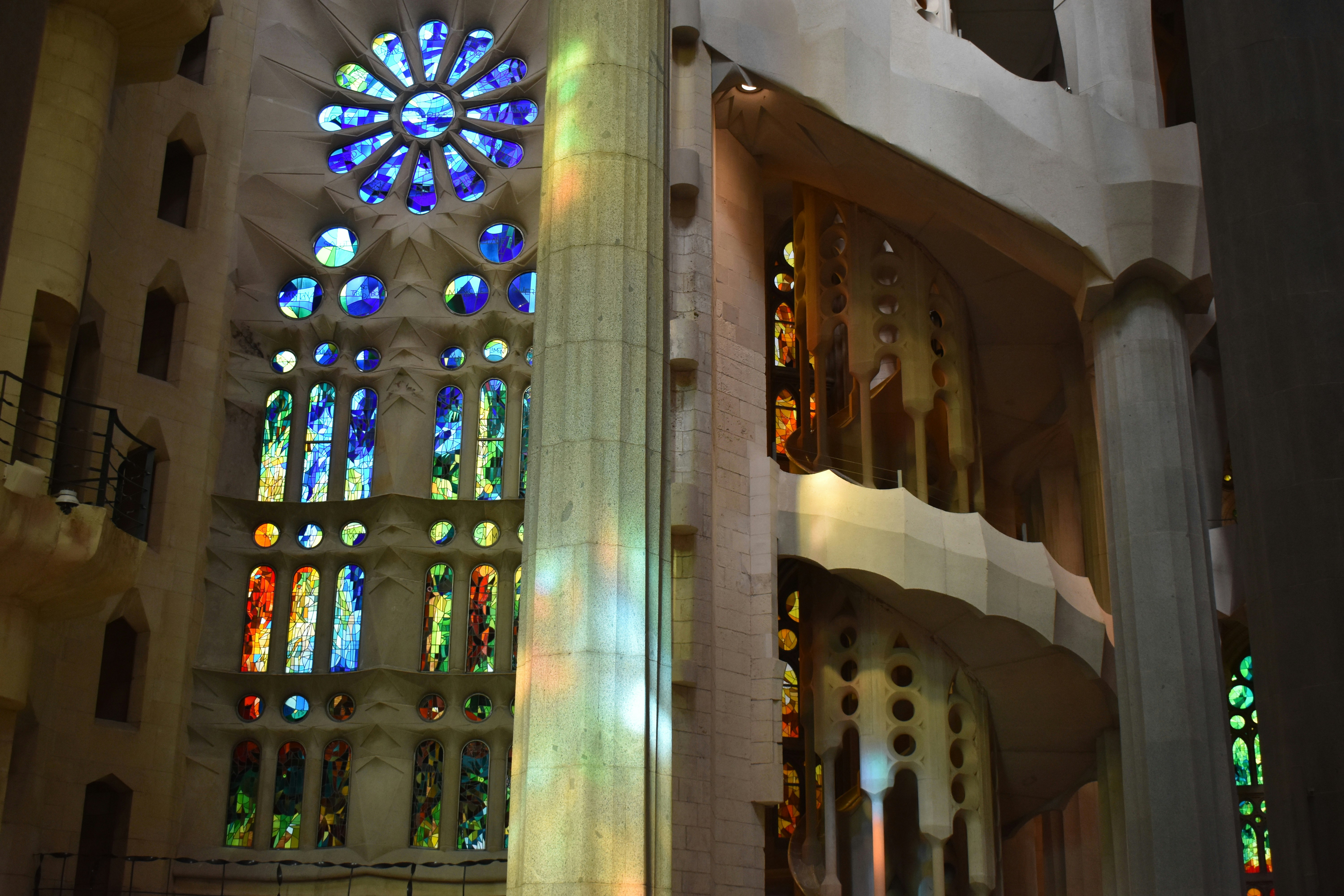 Stained Glass Glimmers Through Stone Arches