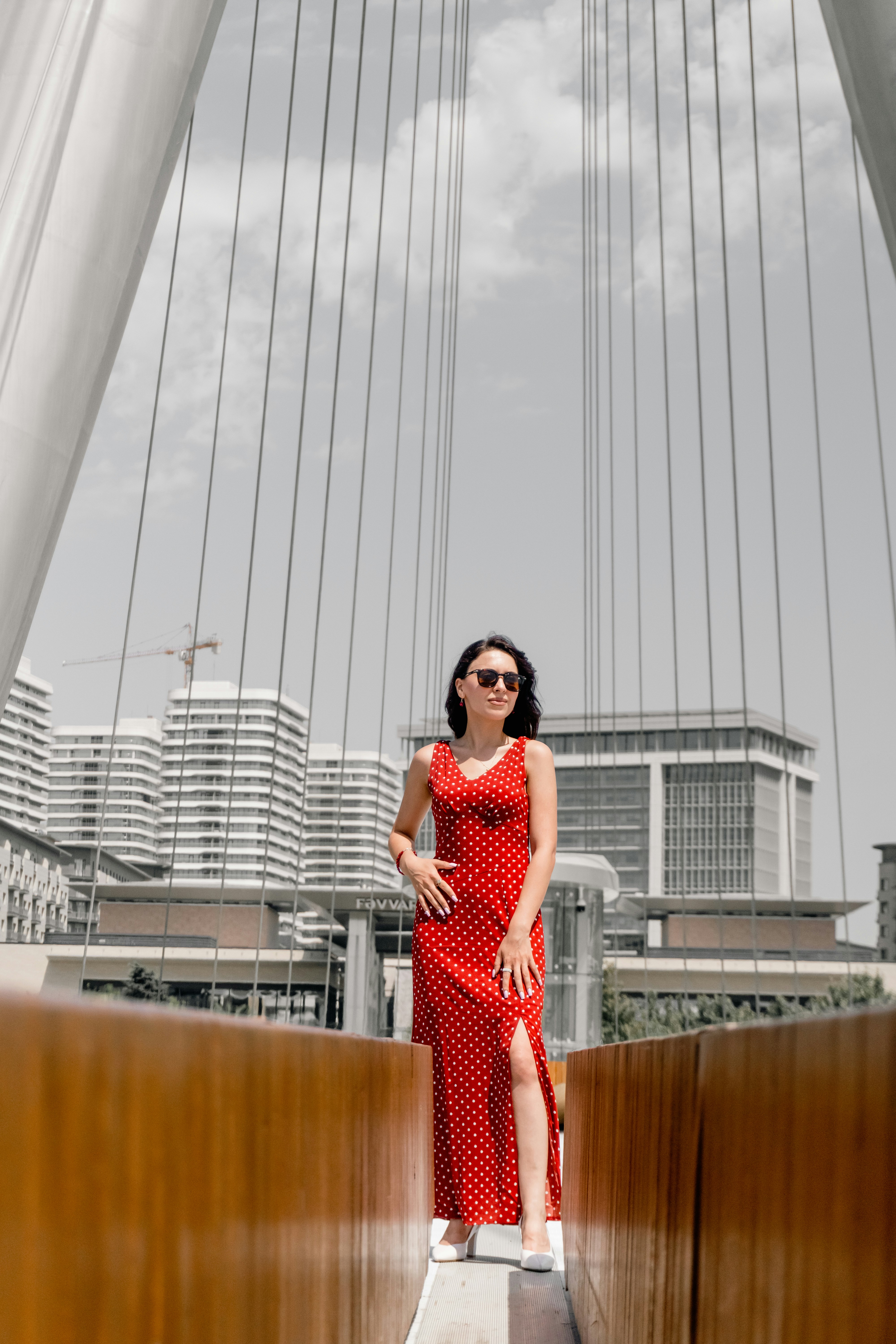 Red Dress on a Suspension: A Solo Portrait on the Bridge