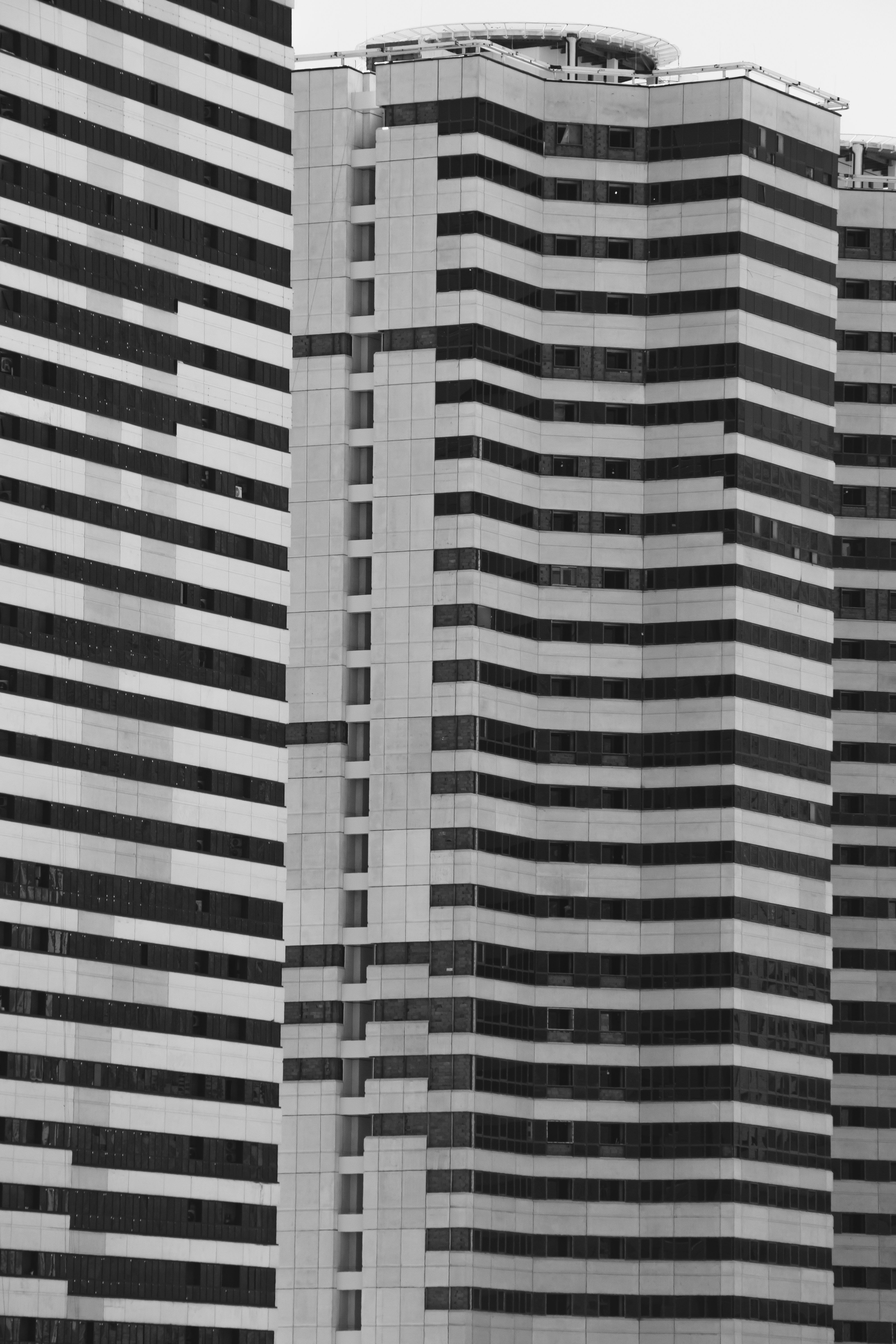 Urban Echoes in Black and White: Twin Facades Align in a Geometric Ballet