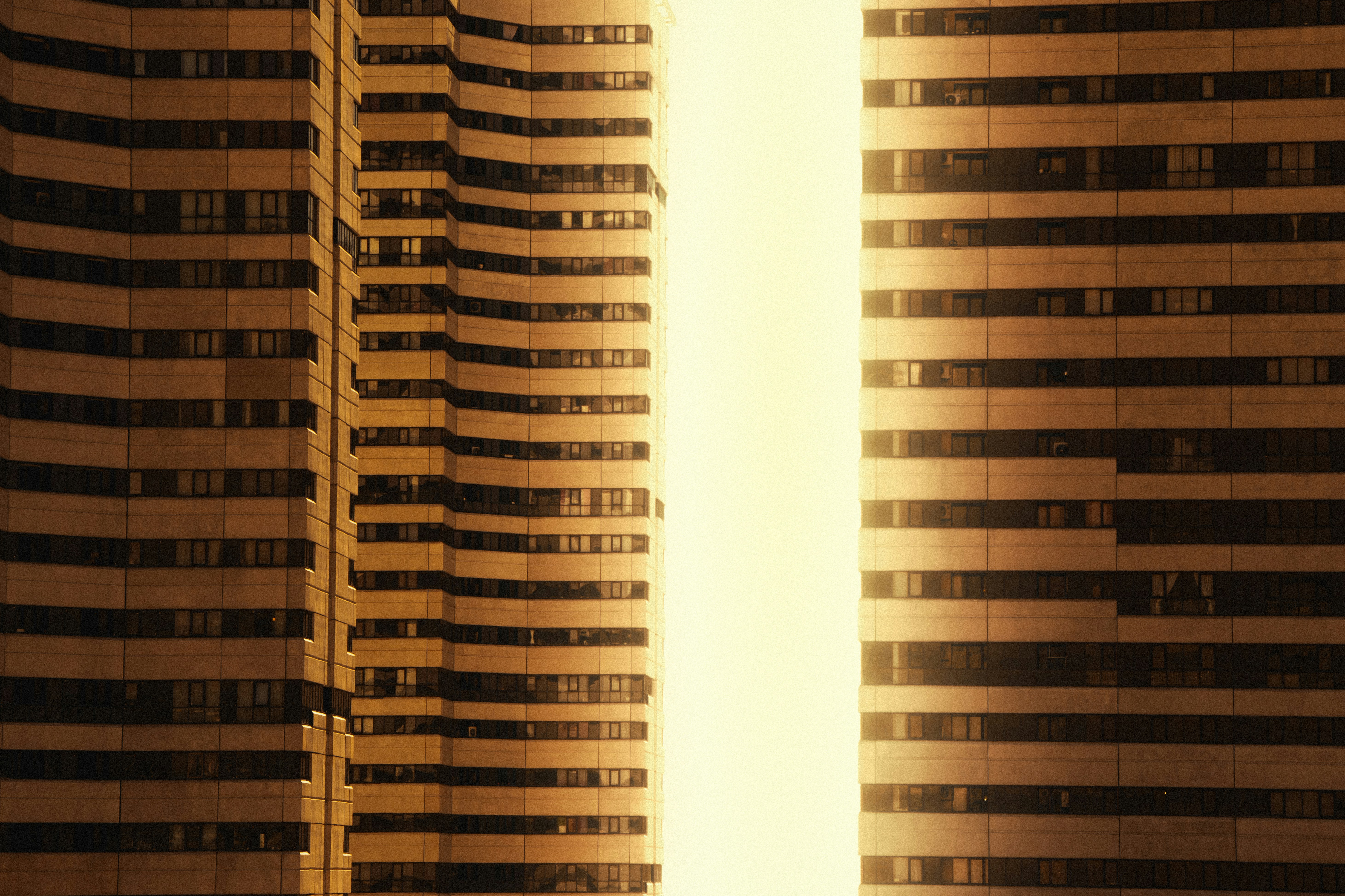 Vertical Convergence: Neon Gap Between Twin Facades