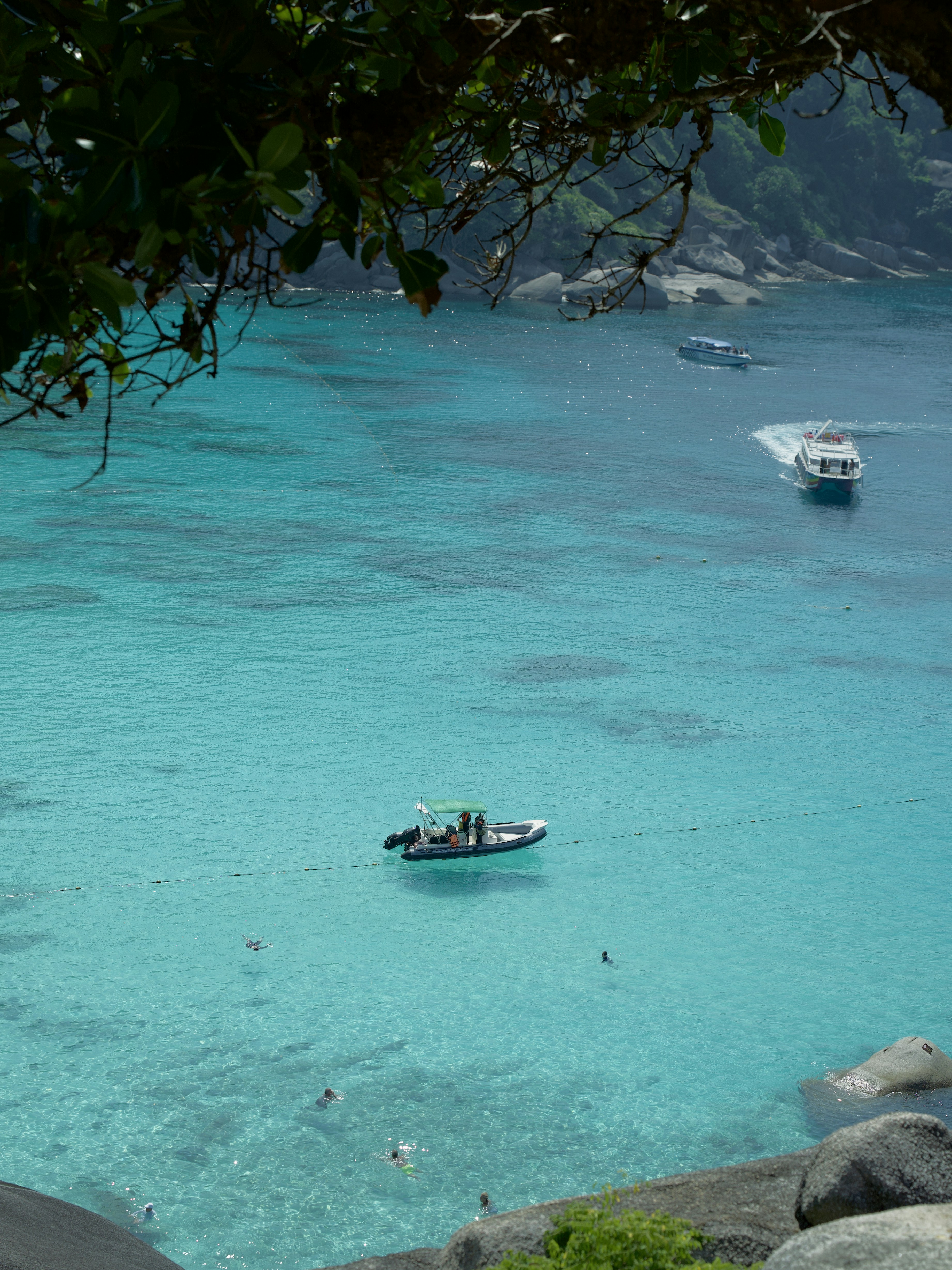 Turquoise Quiet: Boats Idle in an Emerald Sea
