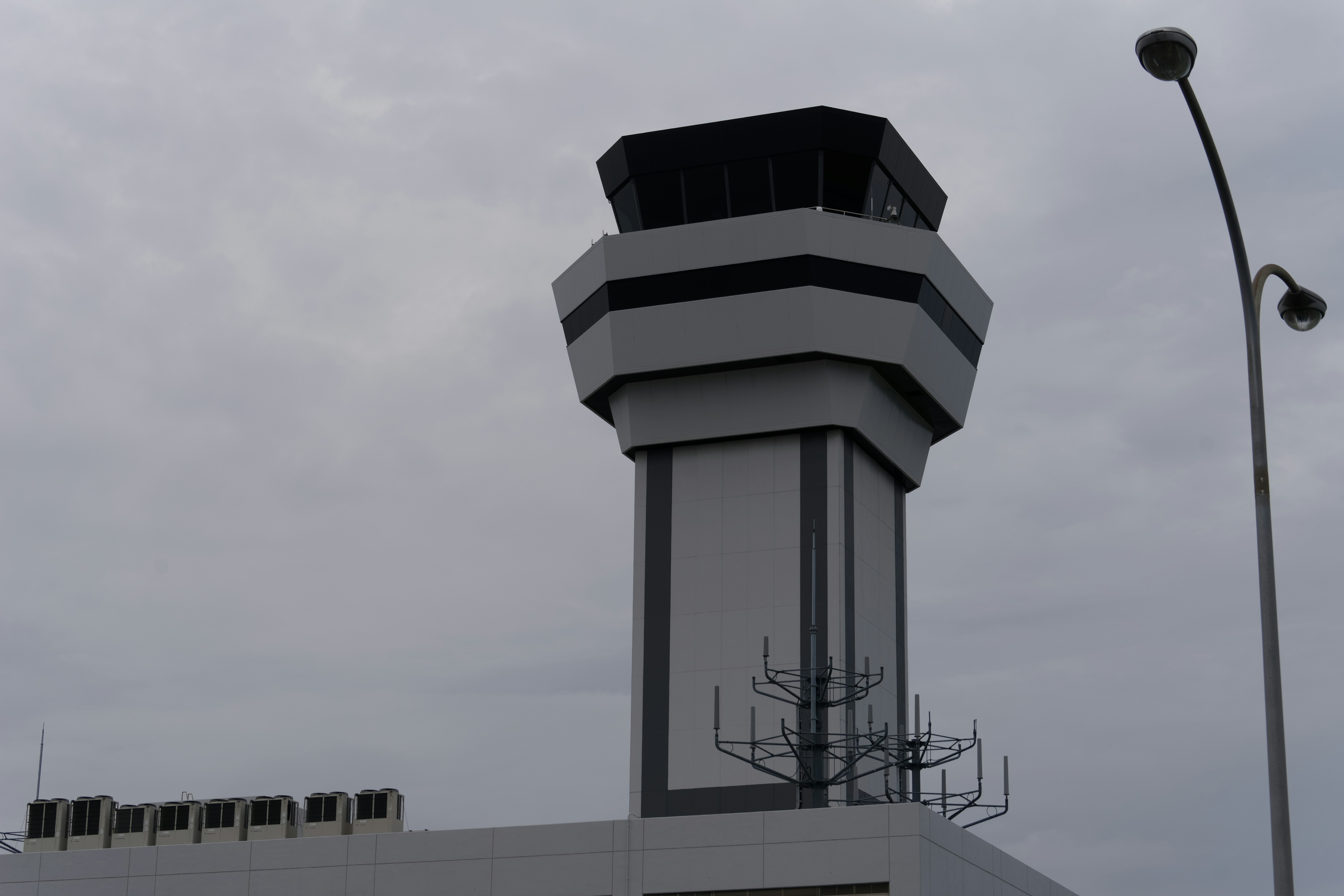 Control Tower Silhouette under Overcast Sky