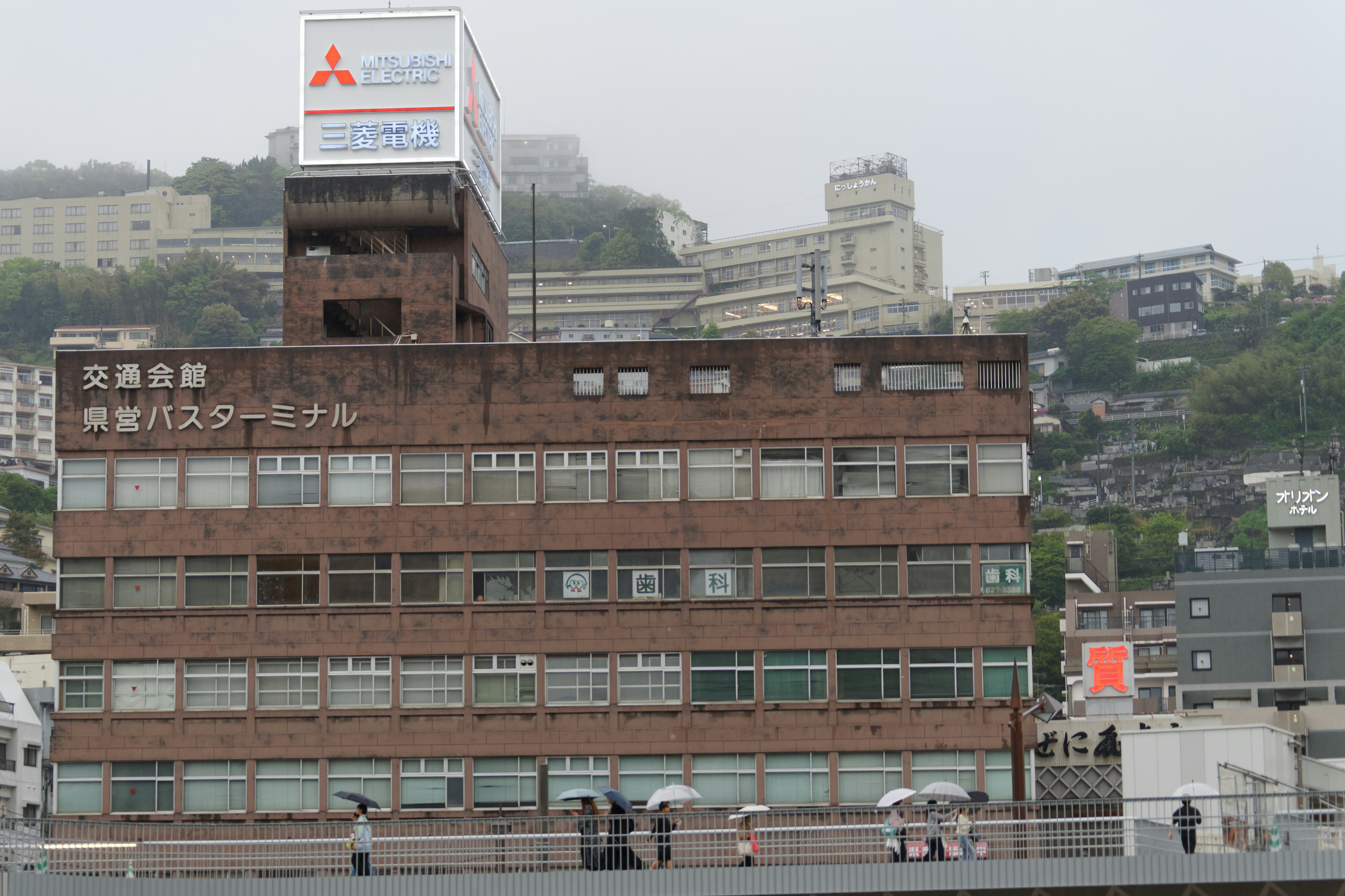Brick Facade Overlooking the City: A Terminal Building with Subtle Cityscape